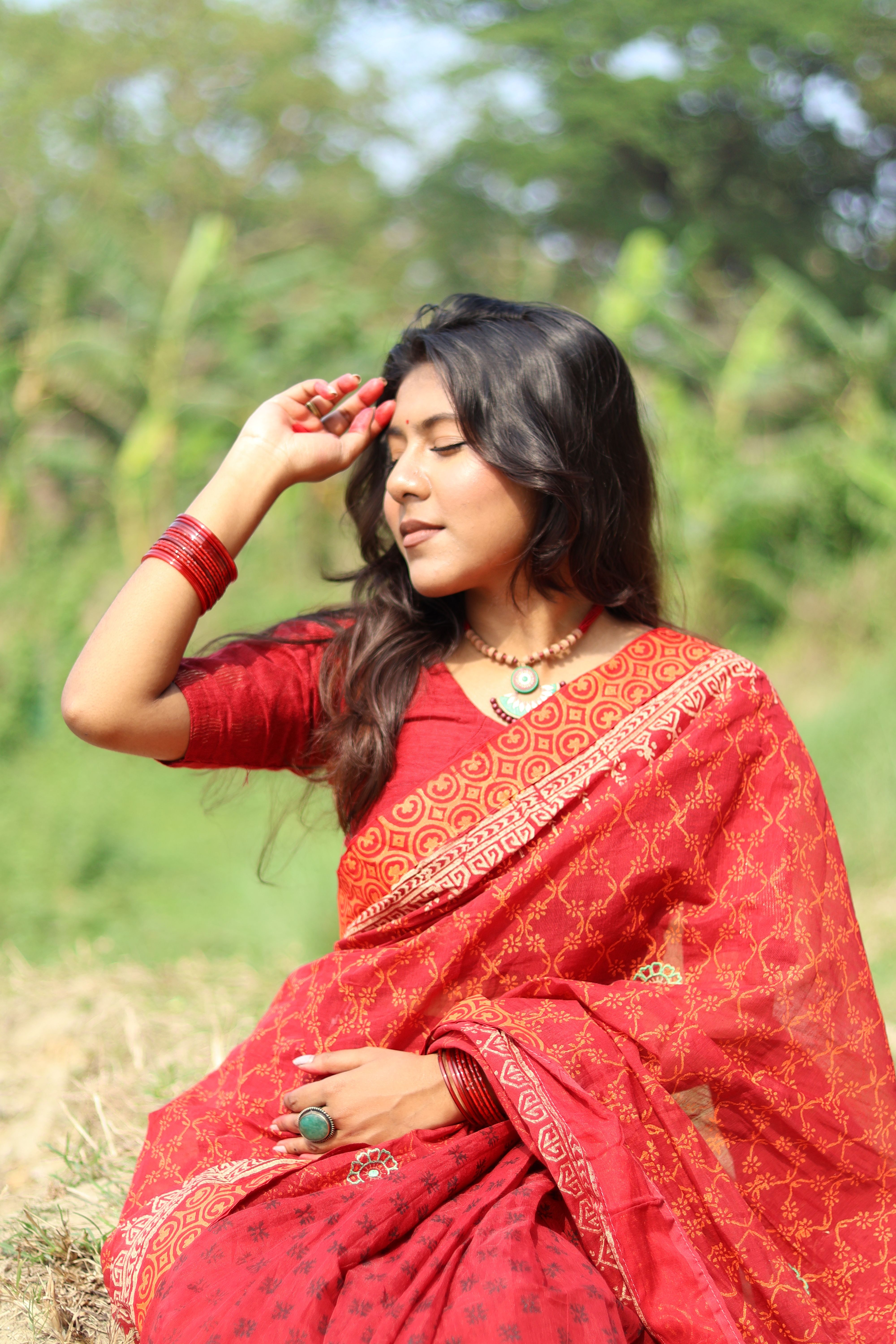 Elegant Woman in Traditional Red Sari Outdoors · Free Stock Photo