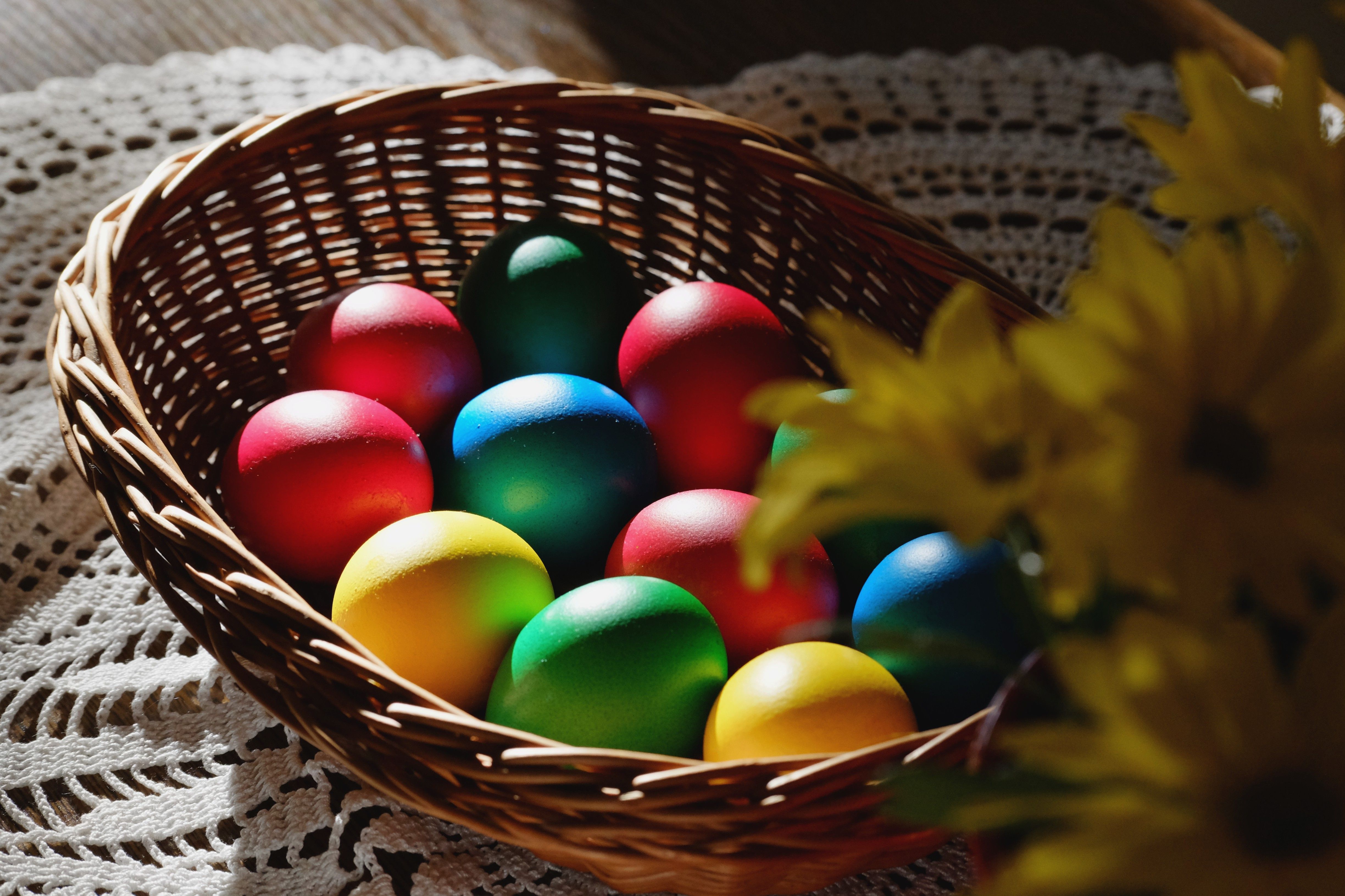 Colorful Easter Eggs in Woven Basket · Free Stock Photo