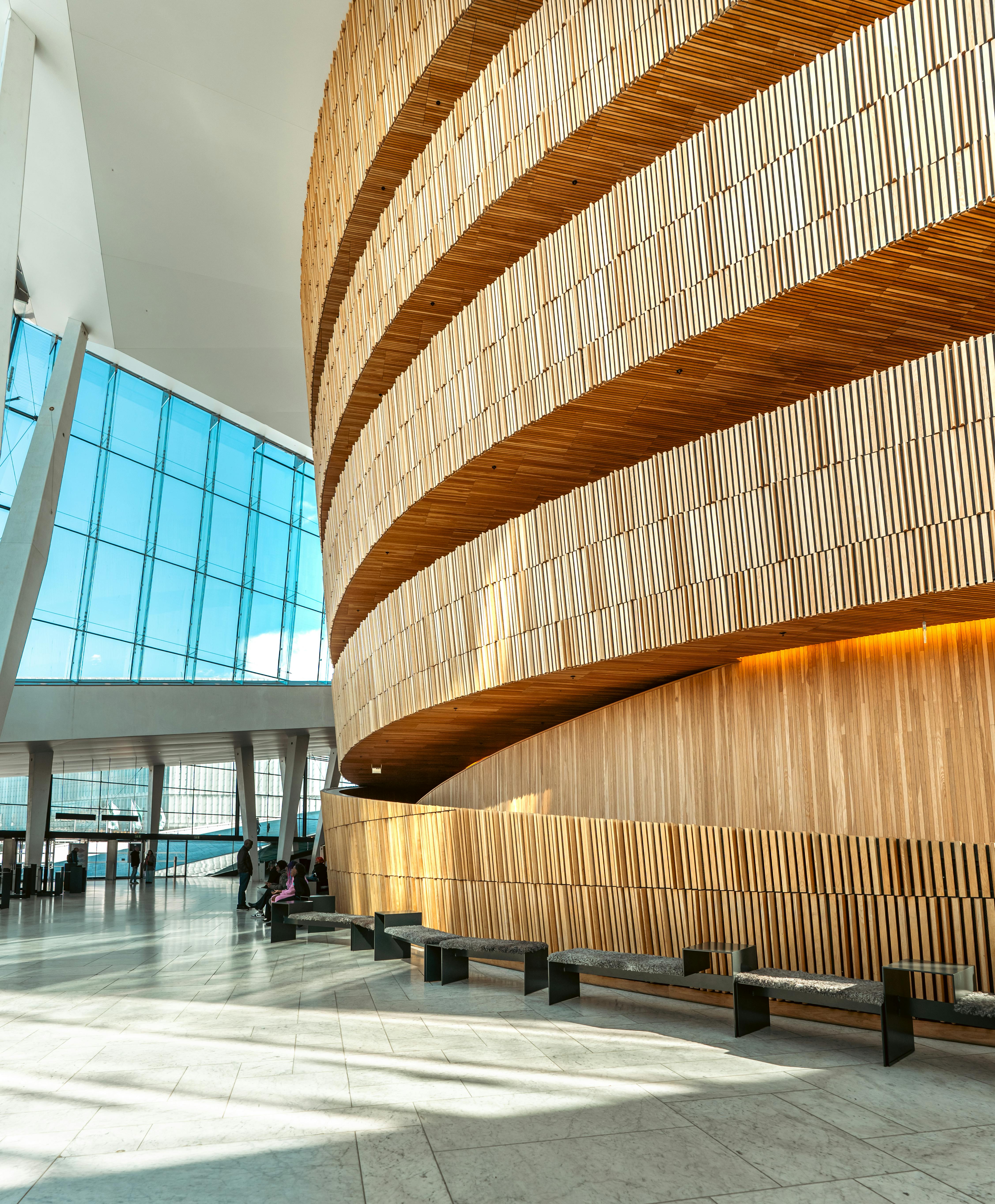 Modern Architectural Interior with Curved Wooden Wall · Free Stock Photo
