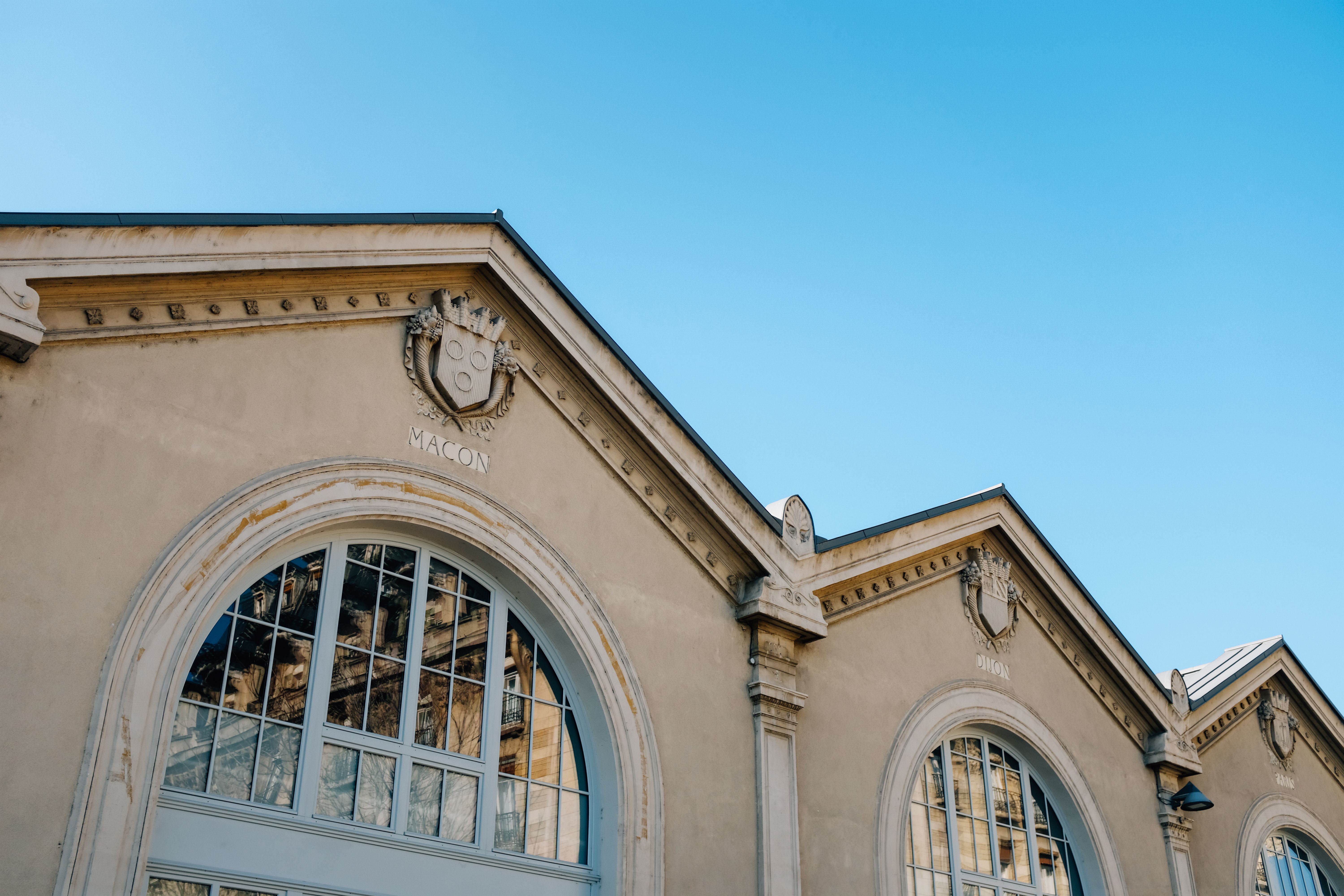 Beige Concrete Building Under Blue Sky · Free Stock Photo
