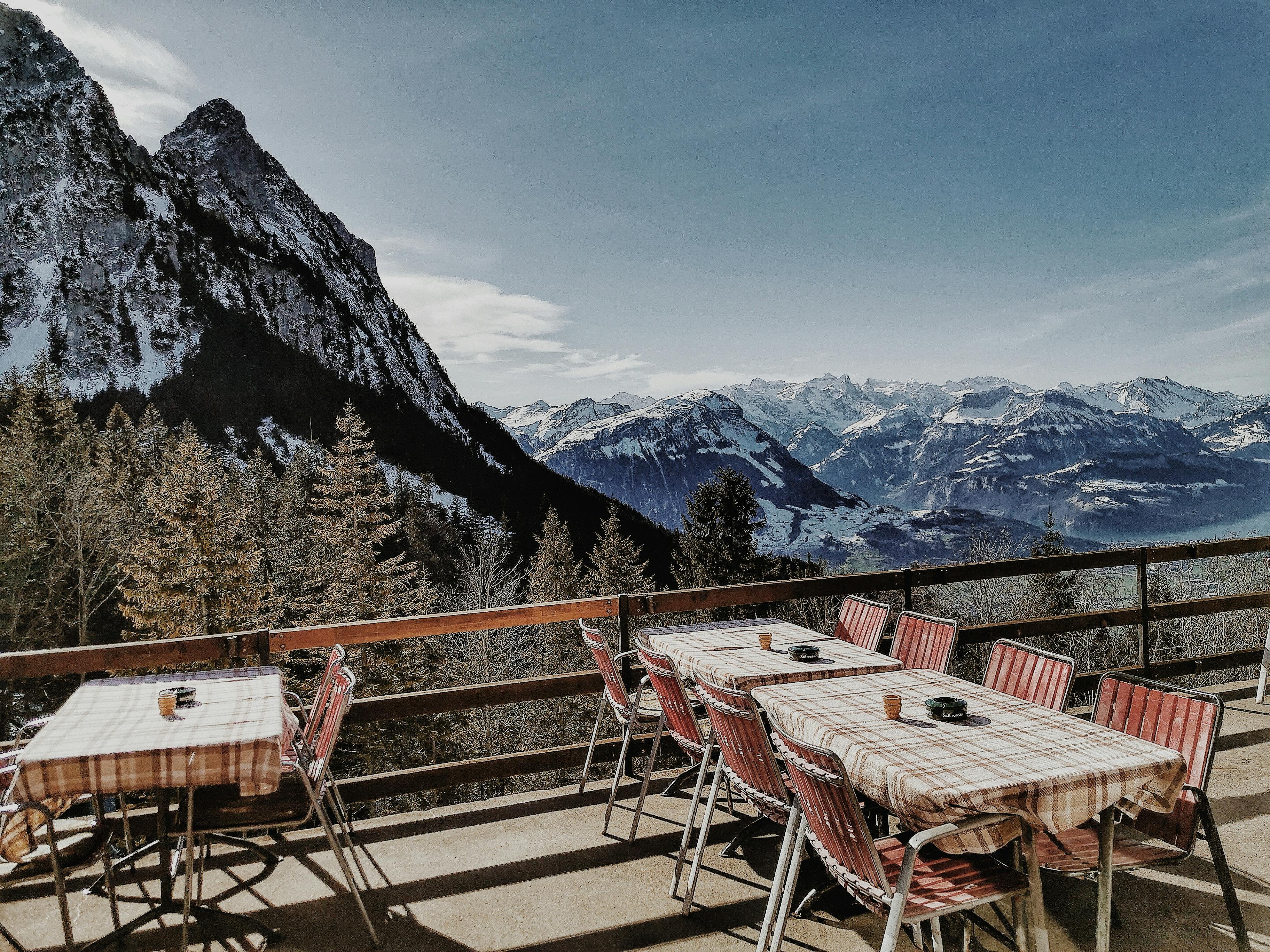 Restaurant Near Mountains Covered with Snow · Free Stock Photo