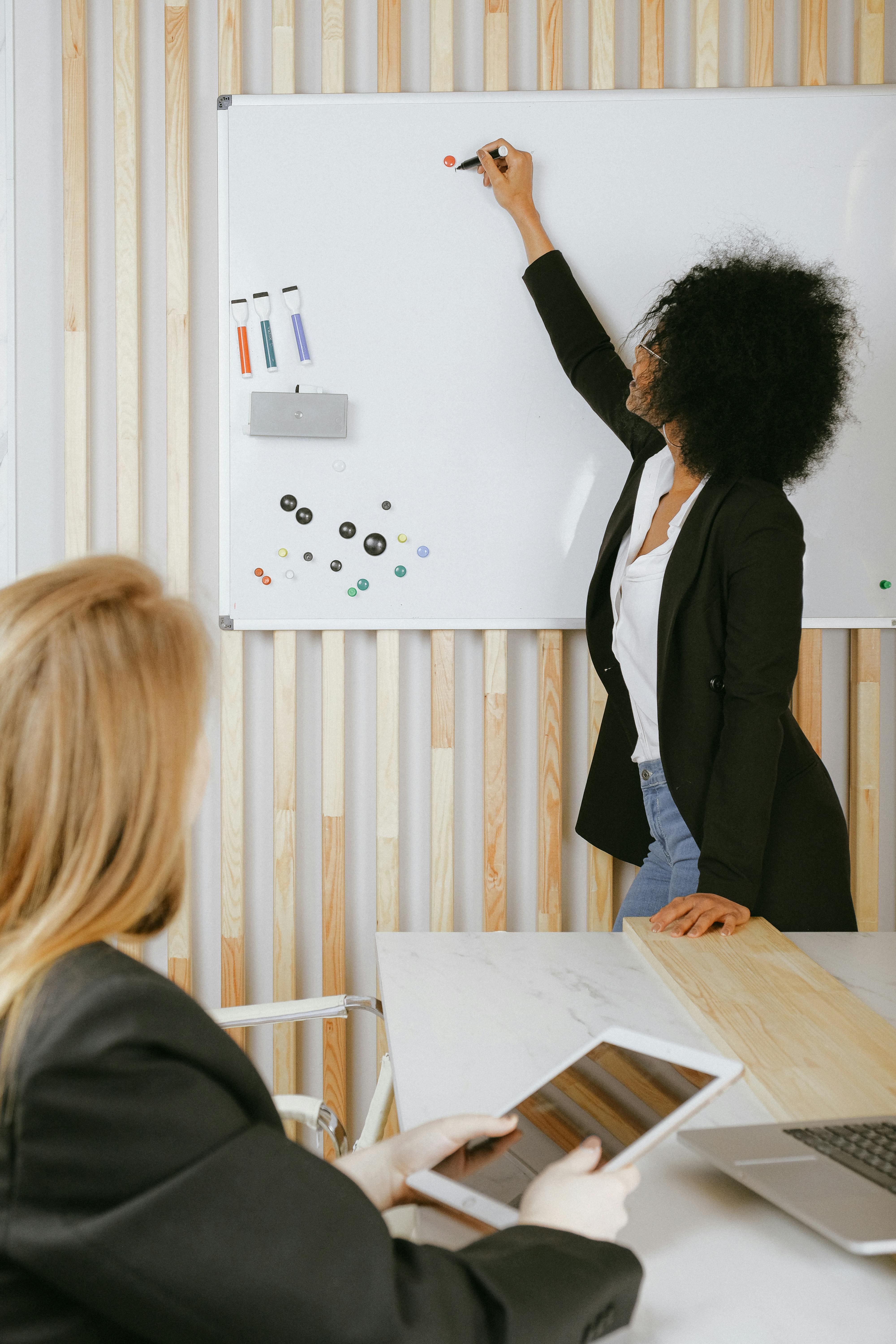 Woman Writing on Whiteboard · Free Stock Photo
