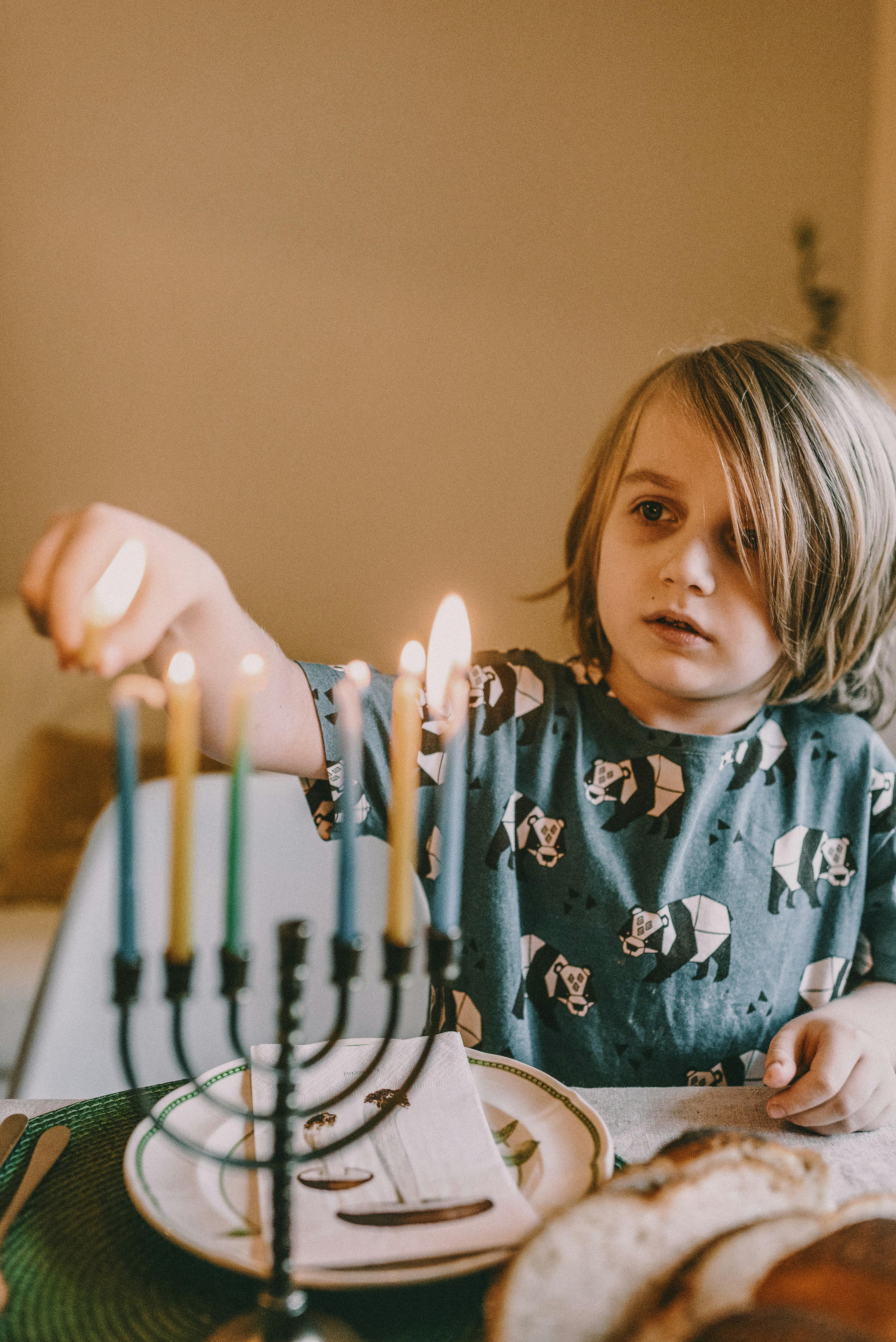 Boy Lighting Menorah · Free Stock Photo