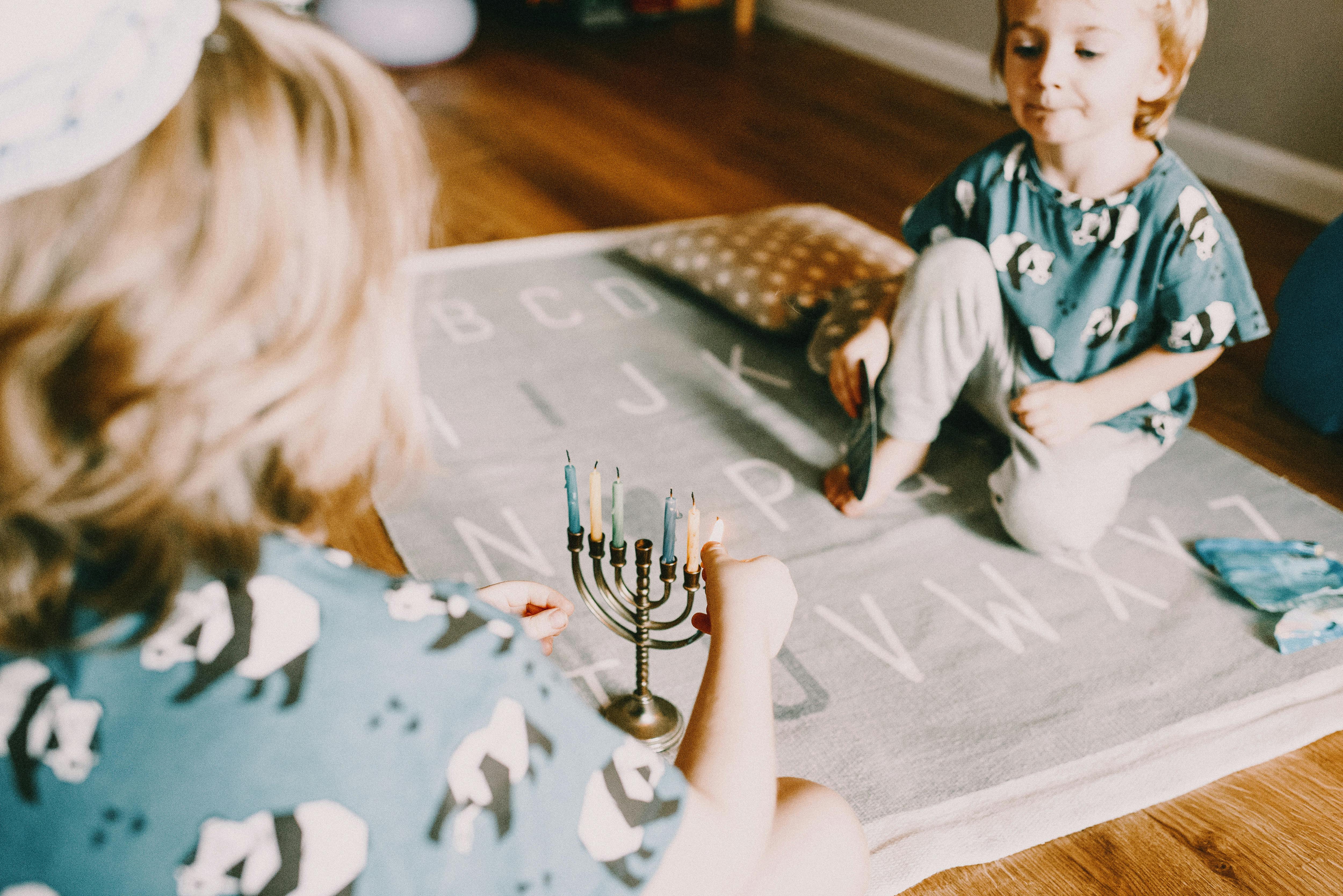 Boy Lighting Menorah · Free Stock Photo