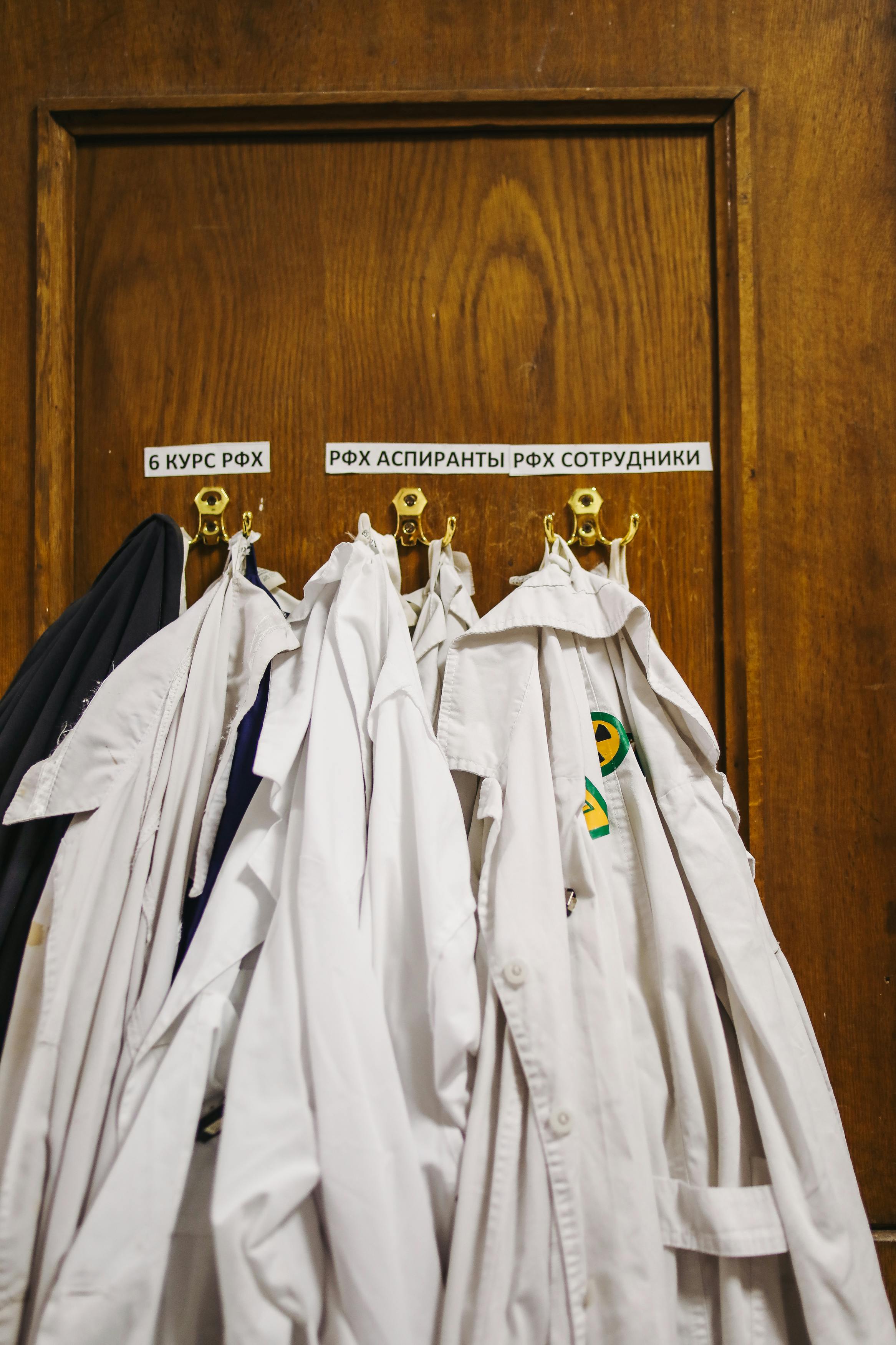 Laboratory Gown Hanging On The Back Of A Door · Free Stock Photo