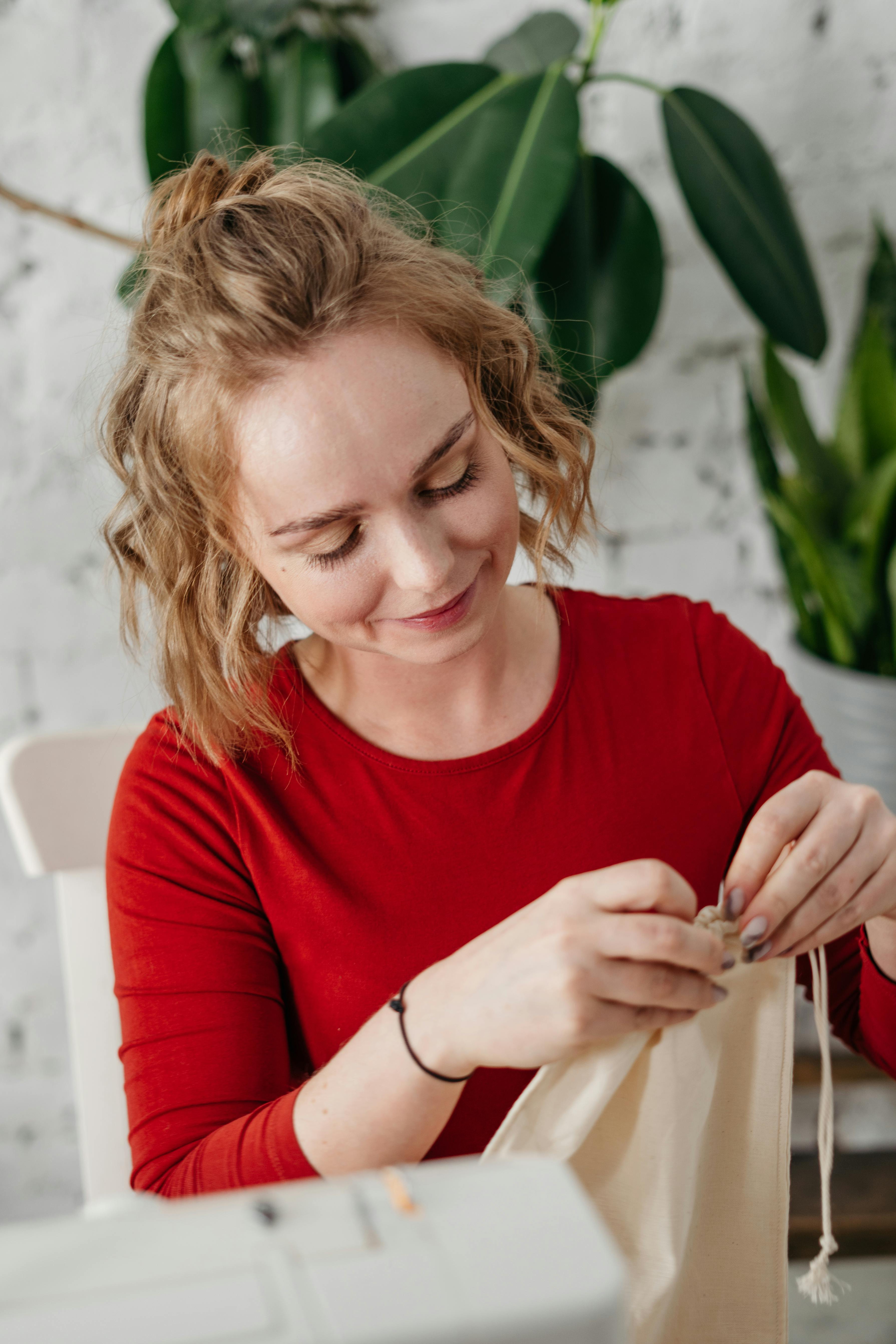 Woman Sewing a Fabric · Free Stock Photo