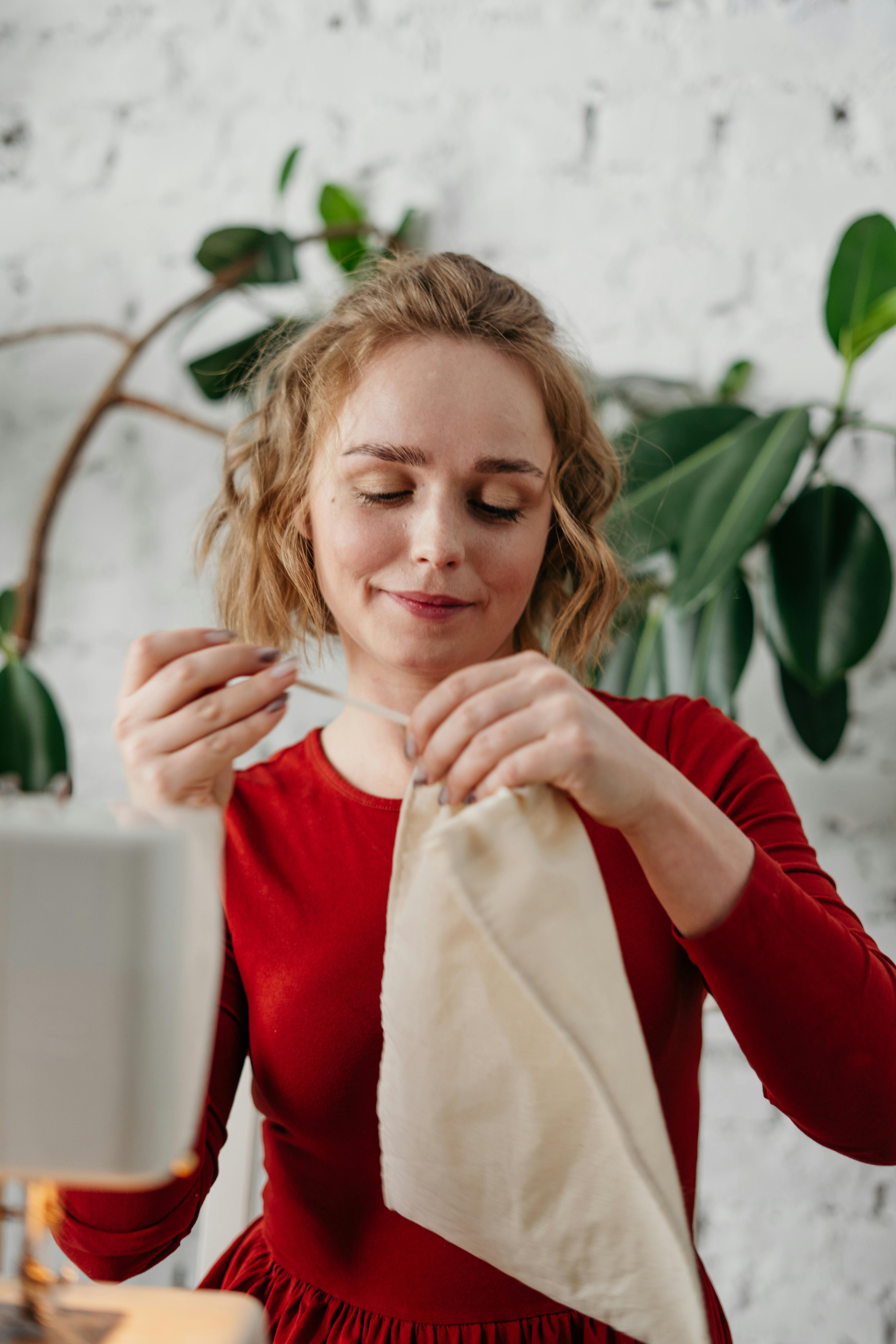 Woman Holding a Piece of Cloth · Free Stock Photo