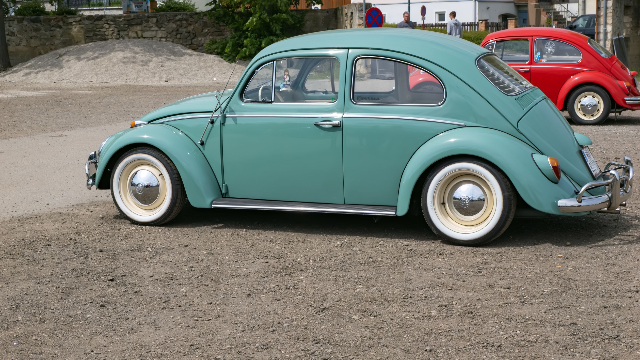 Classic Volkswagen Beetles Parked Outdoors · Free Stock Photo