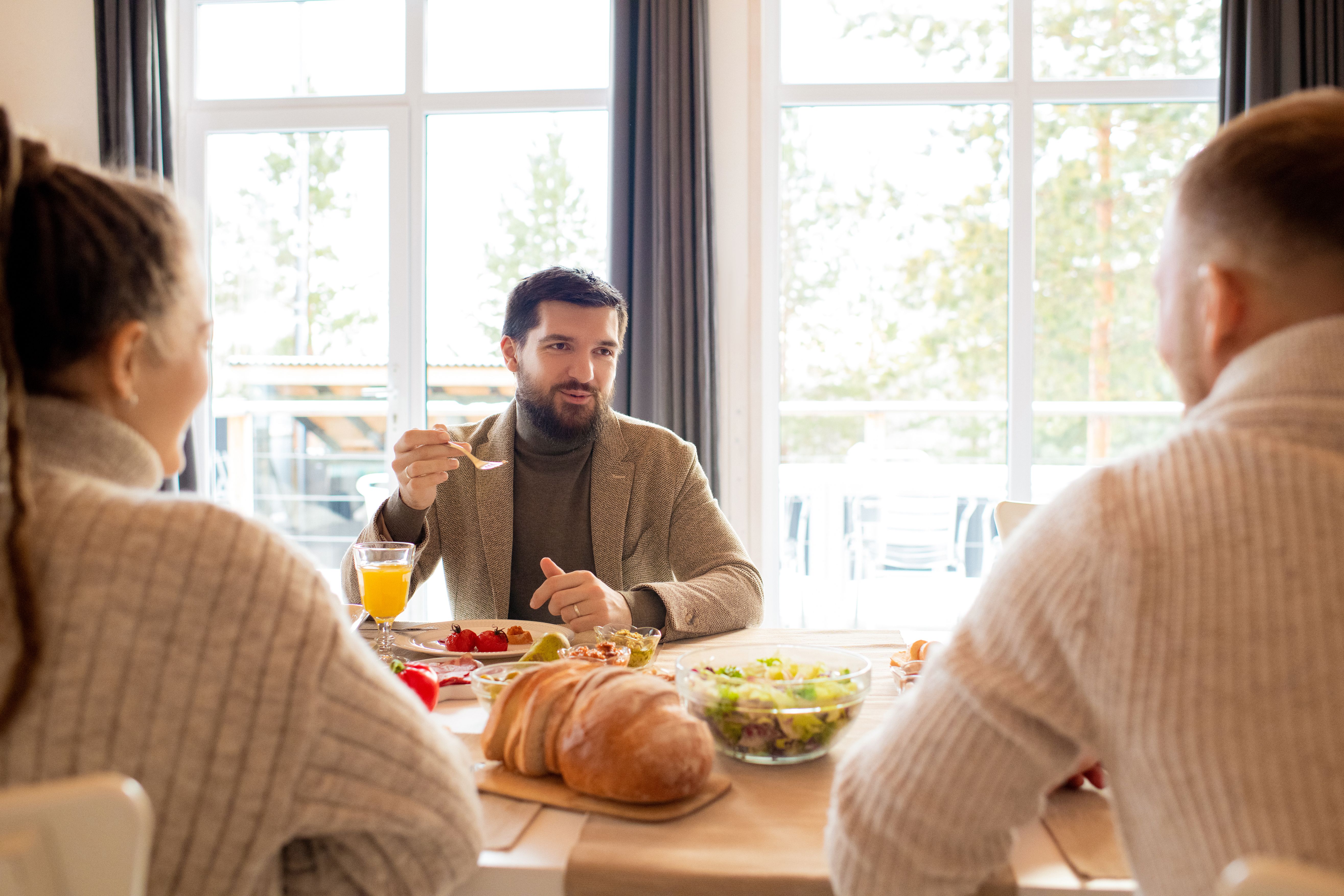 Woman In A Sweater Eating · Free Stock Photo