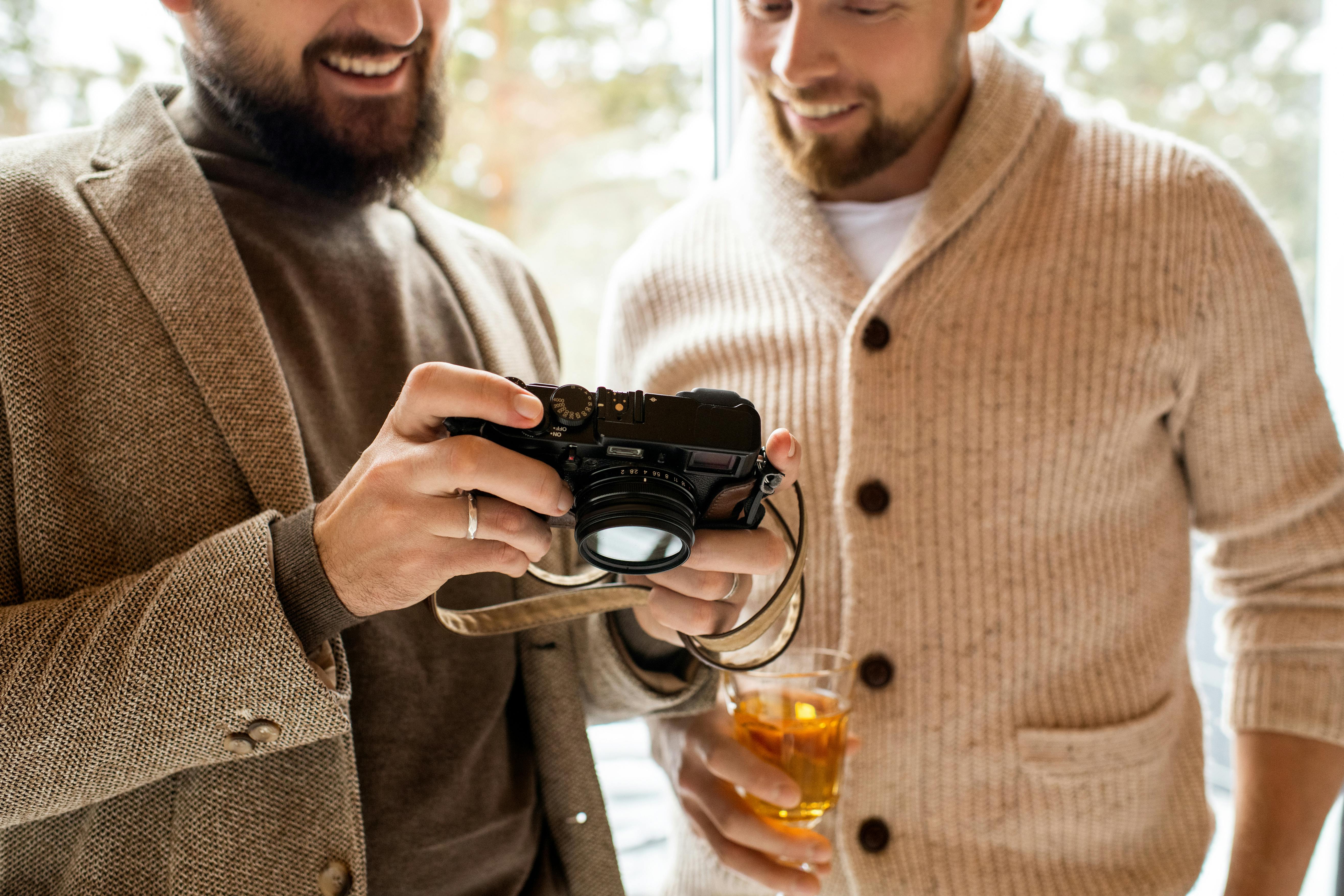 Man In Brown Holding A Camera · Free Stock Photo