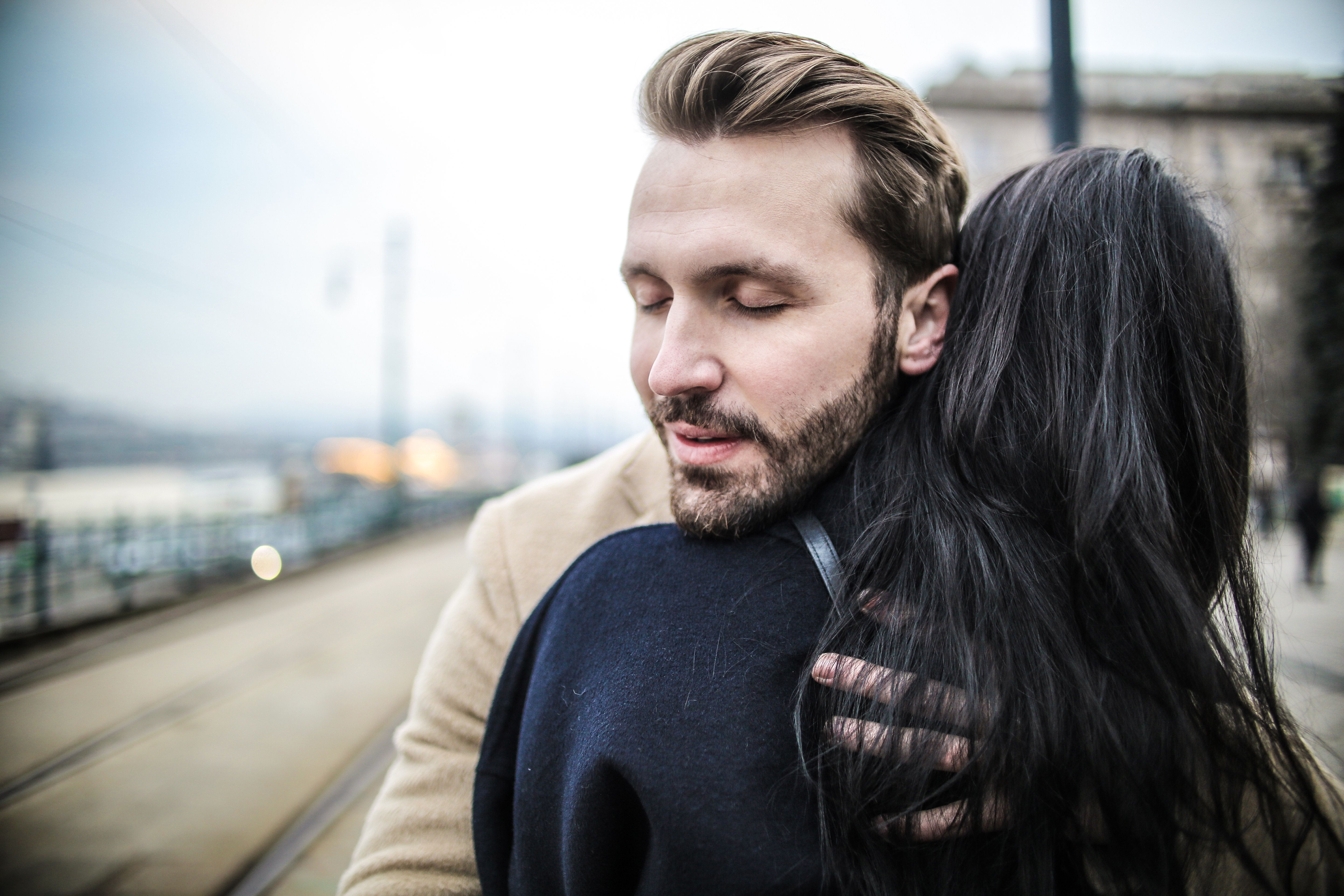 Selective Focus Back View Photo of Woman Hugging Man · Free Stock Photo