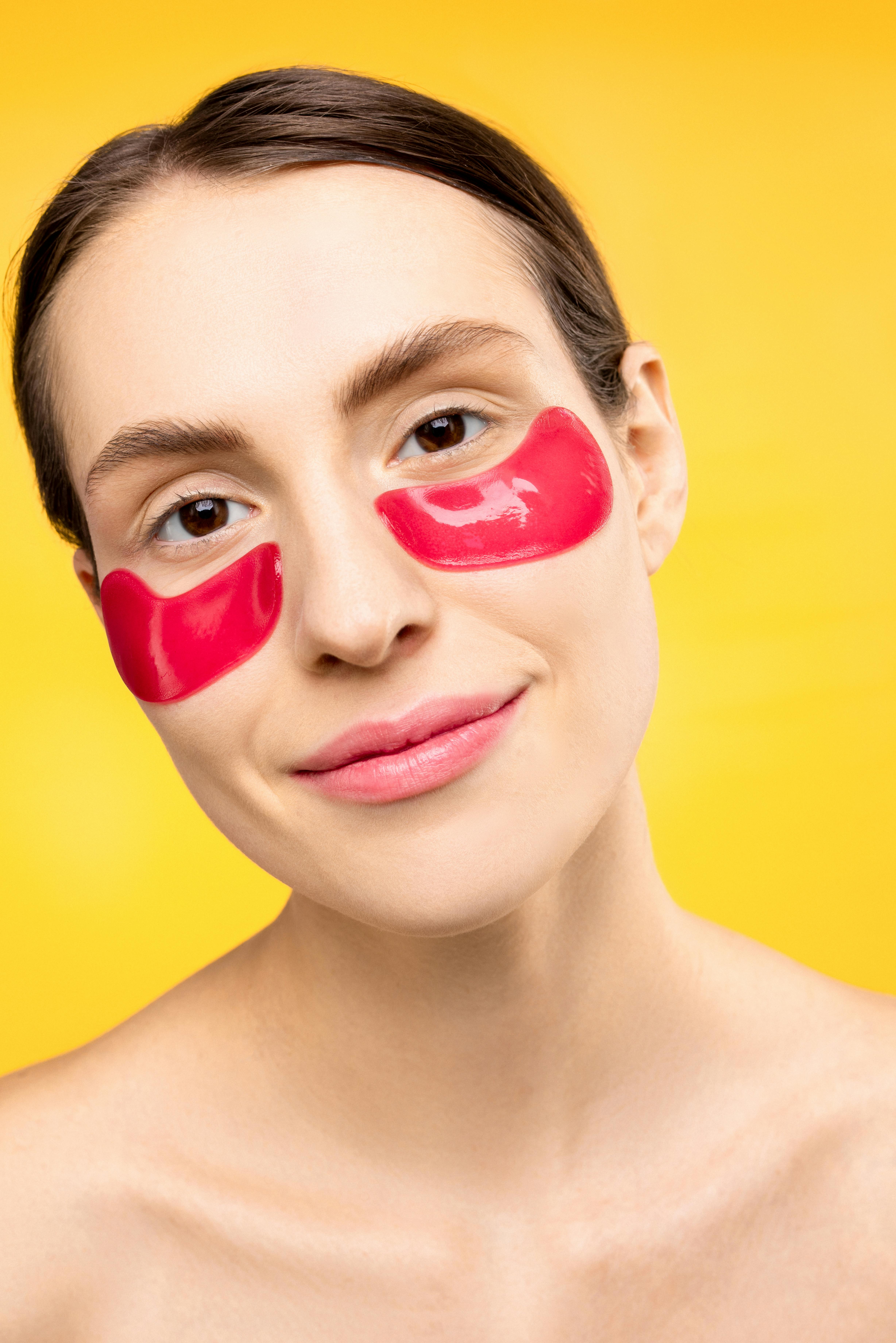 Woman With Red Under Eye Mask · Free Stock Photo