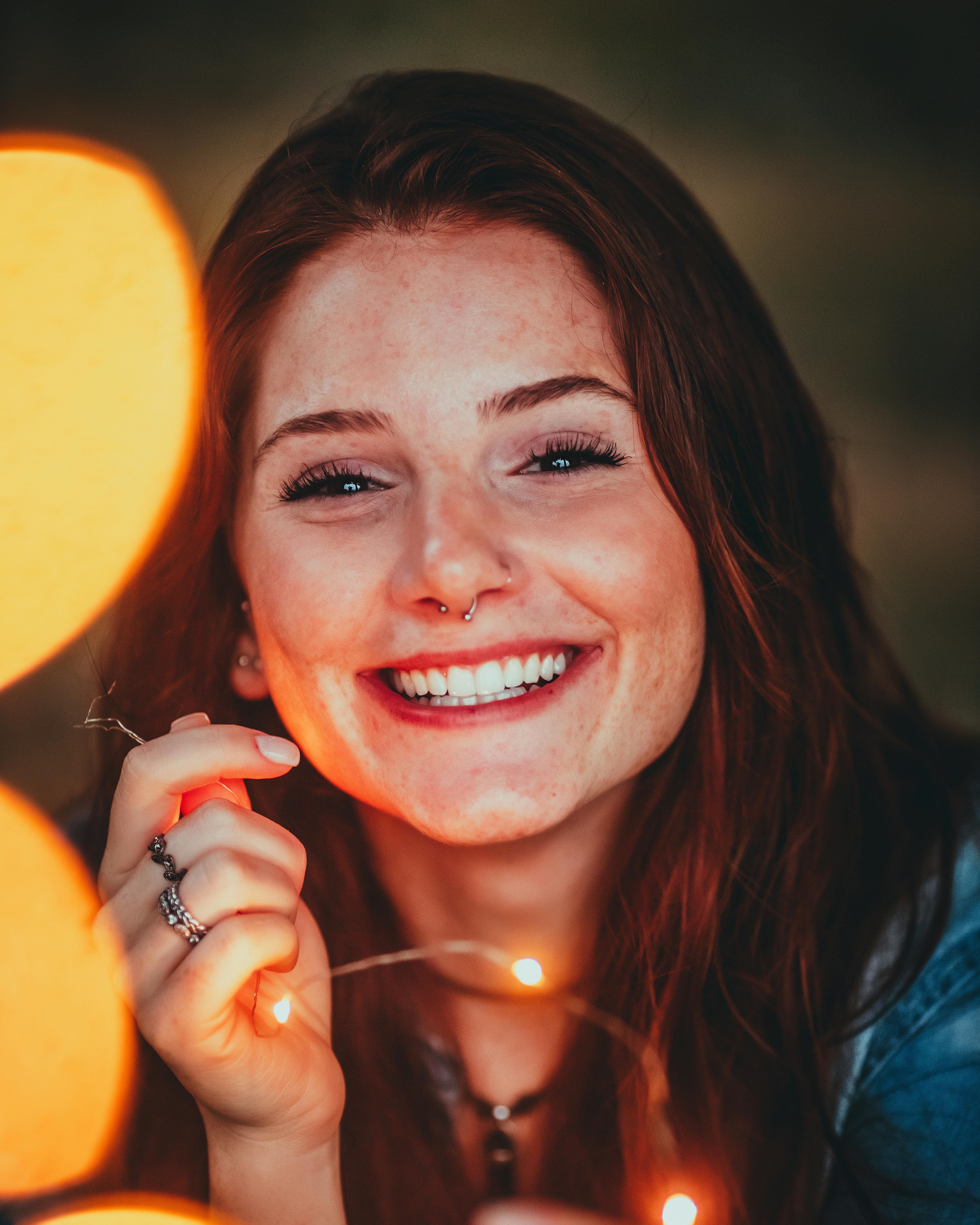 Portrait Photo of Smiling Woman Holding Yellow String Lights · Free ...
