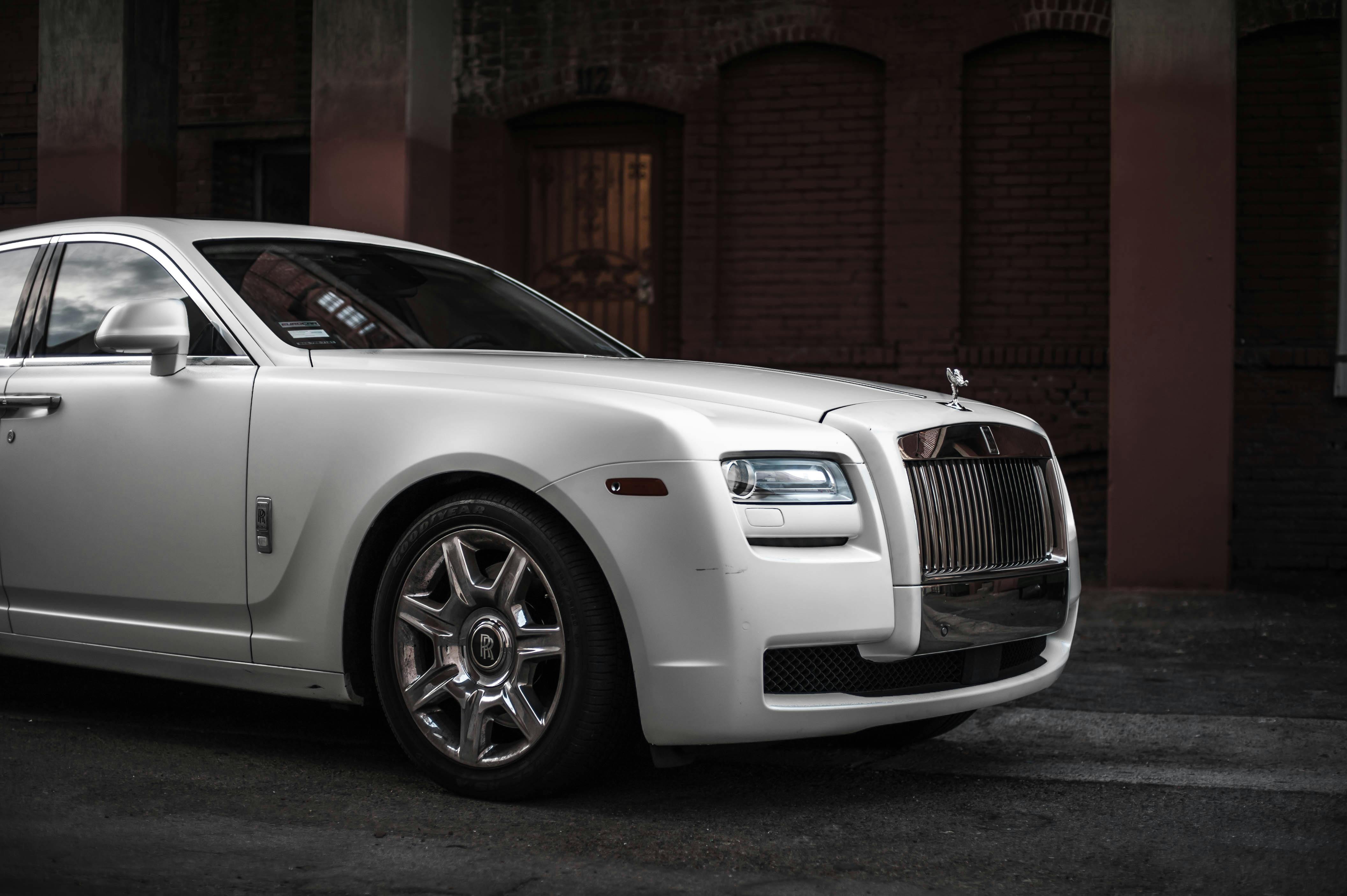 Photo of White Rolls-Royce Ghost Parked Near Brown Building · Free ...