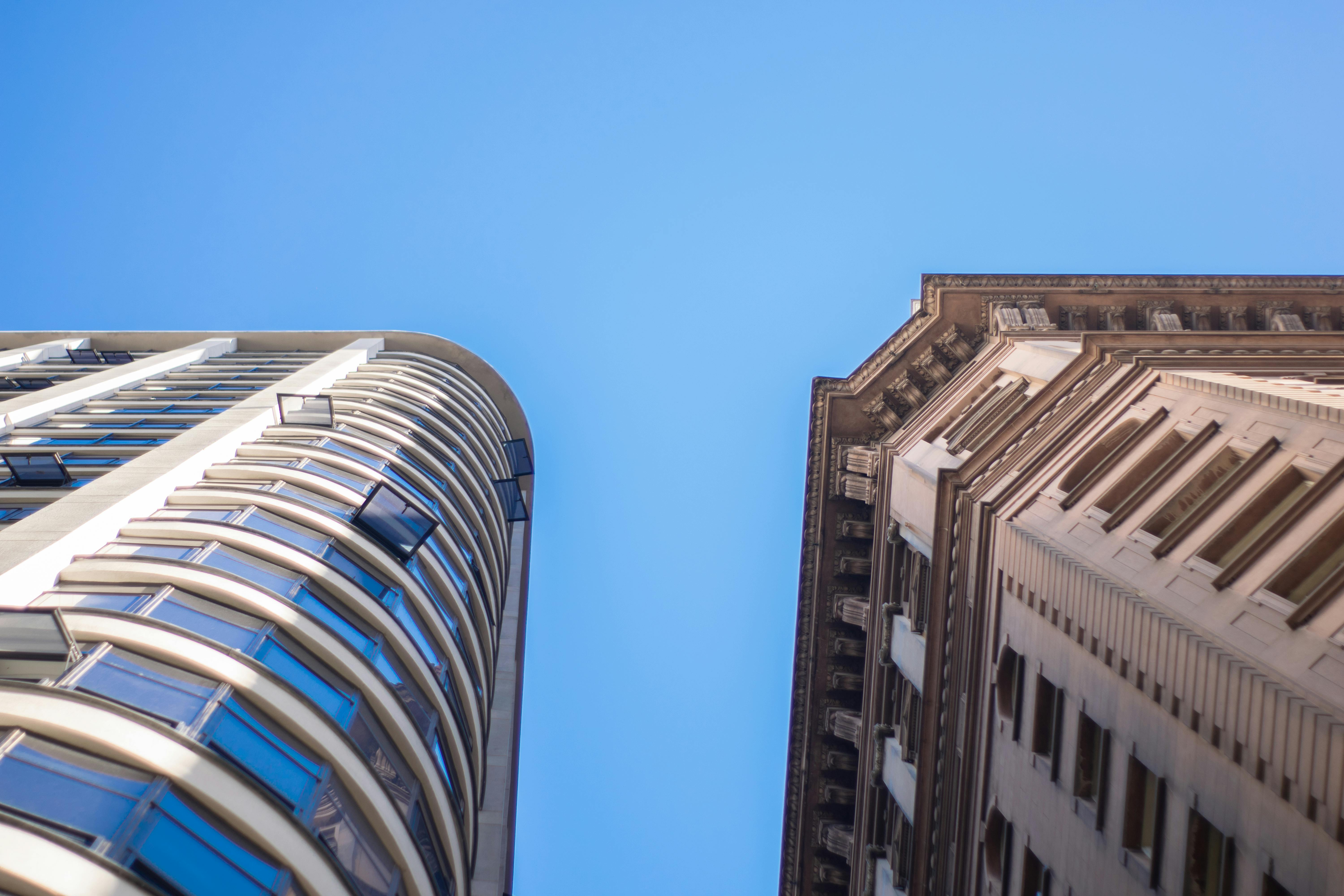 Beige Concrete High-rise Building Under Blue Sky · Free Stock Photo