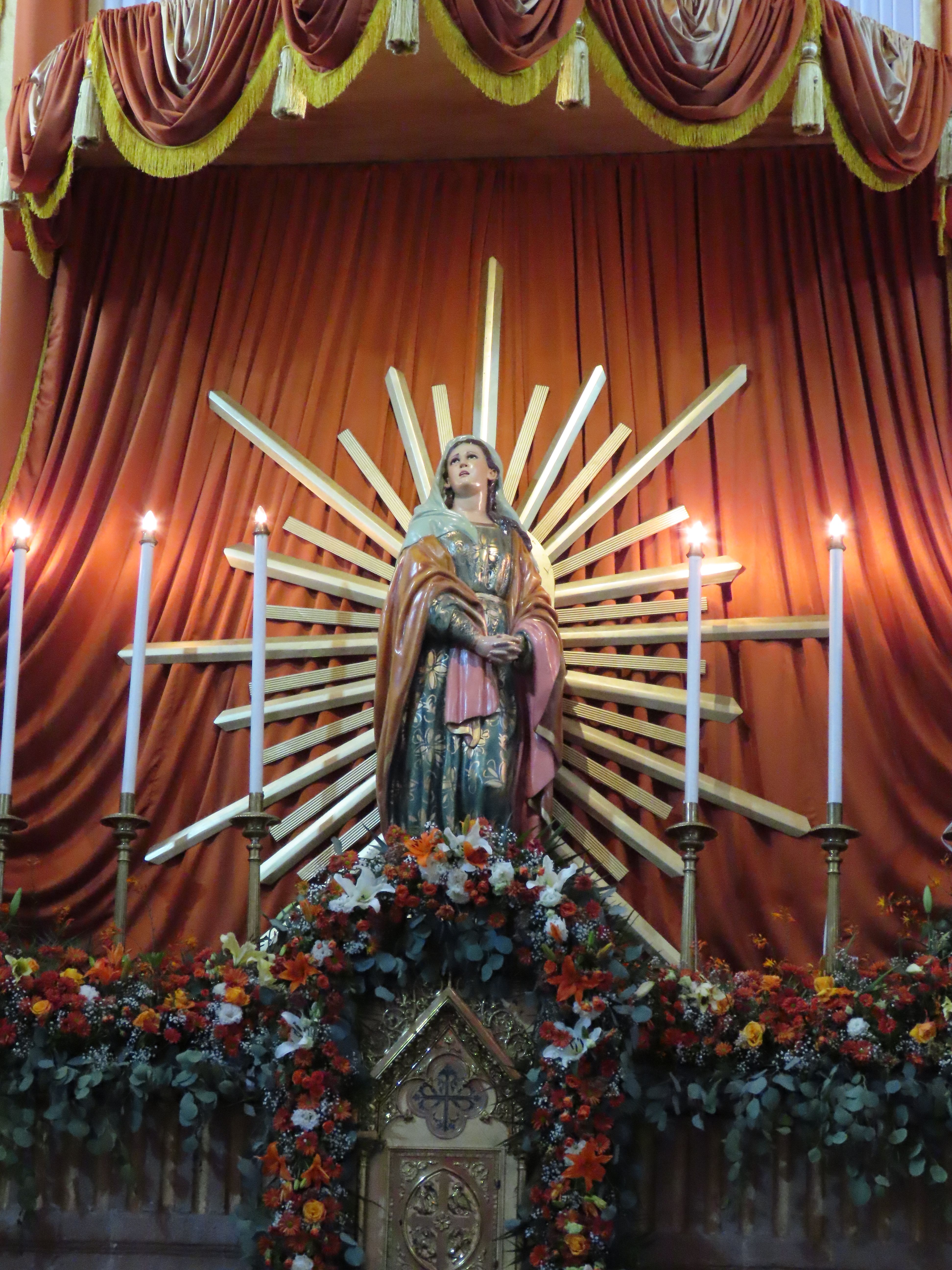 Statue of Saint with Floral Arrangement in Mexico · Free Stock Photo