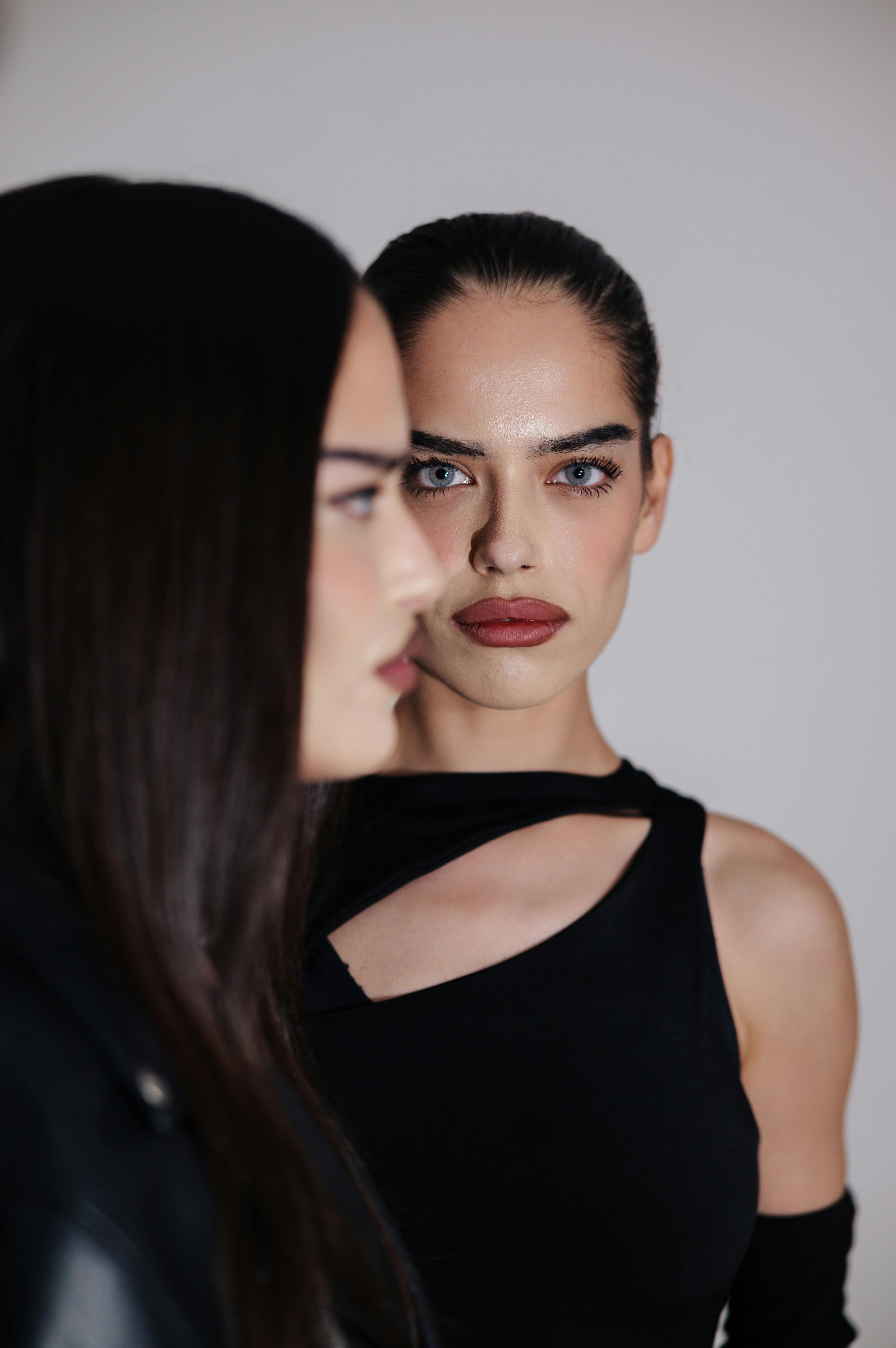 Portrait of Two Women in Stylish Modern Attire · Free Stock Photo