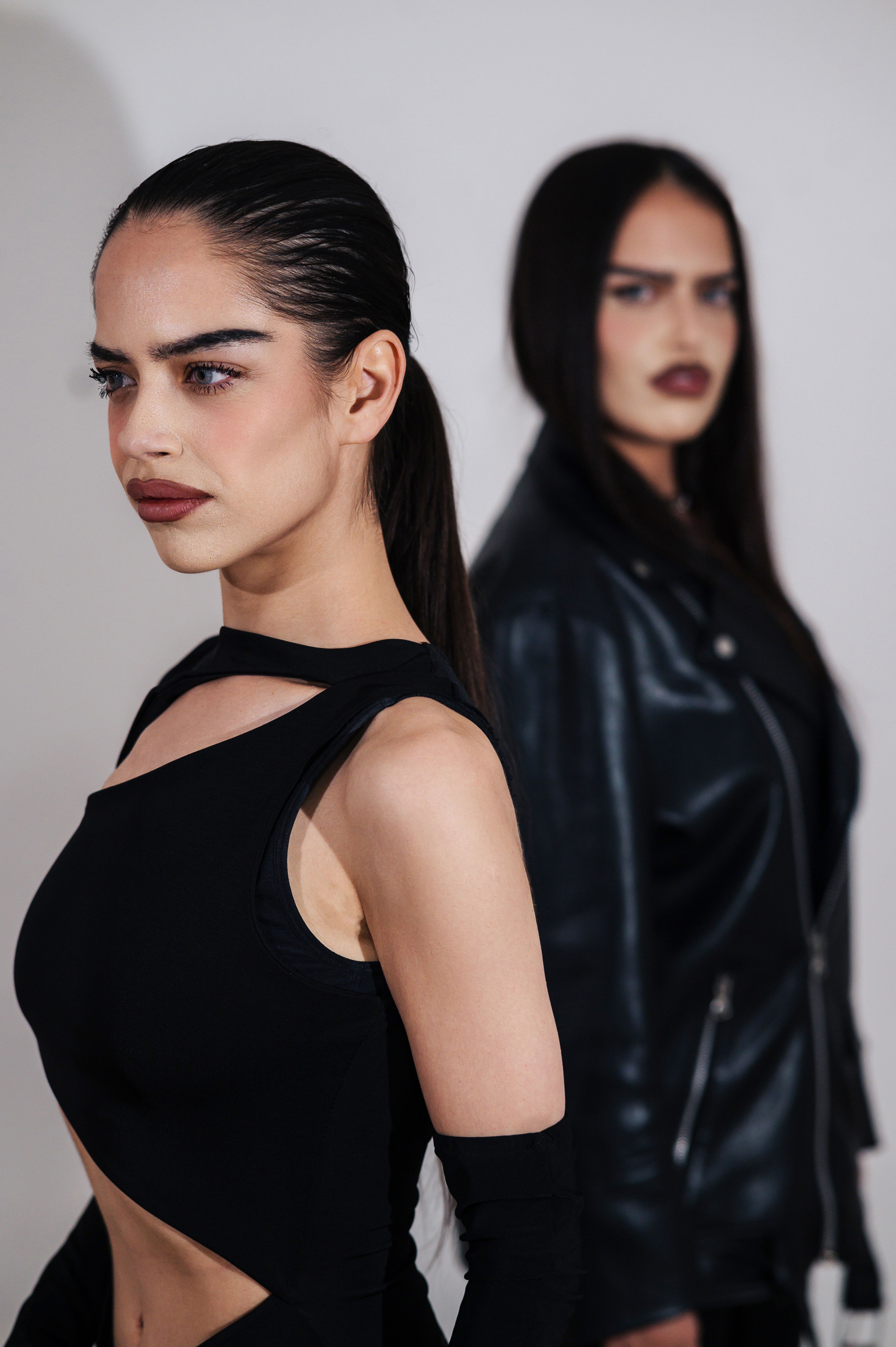 Portrait of Two Women in Stylish Modern Attire · Free Stock Photo