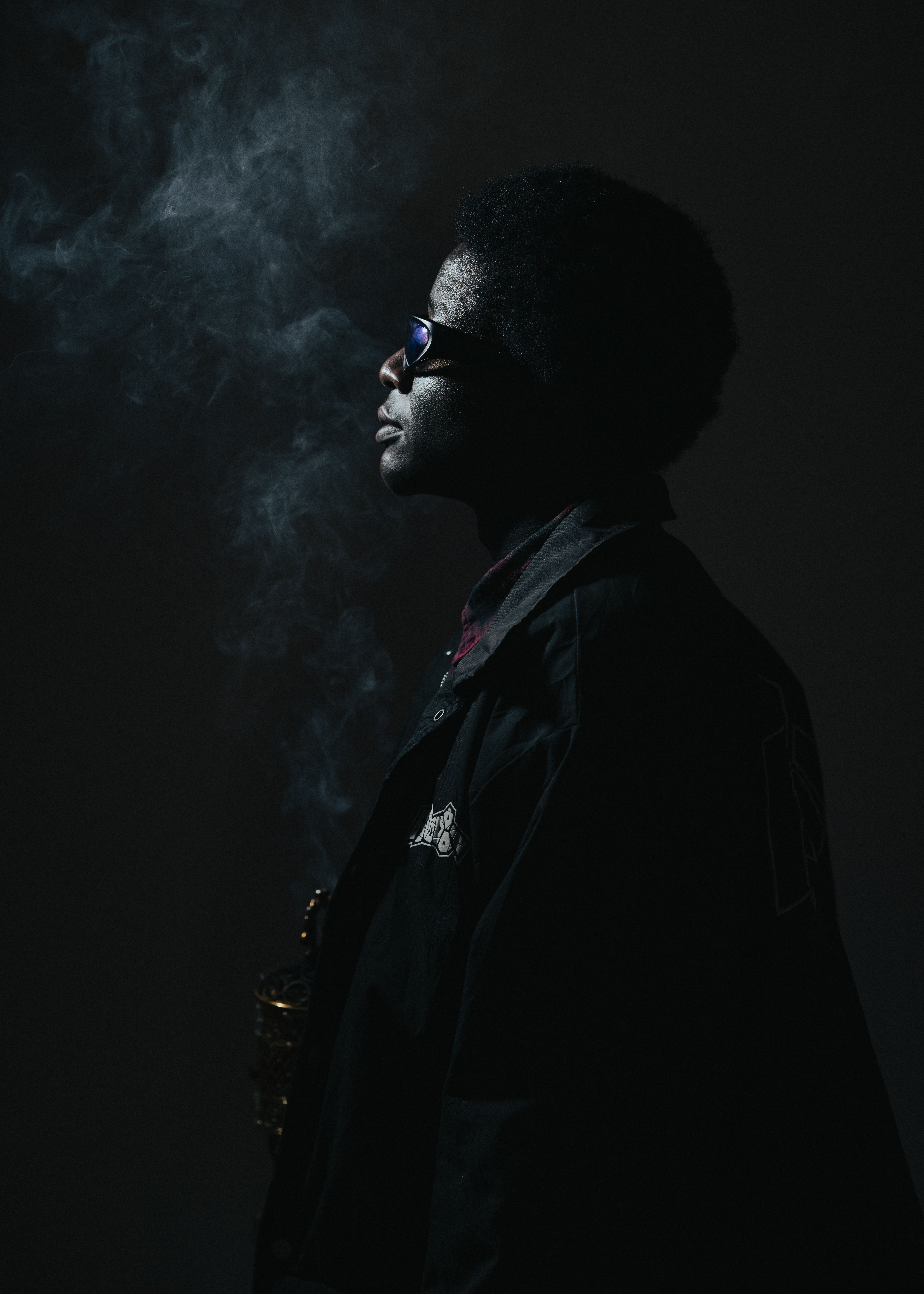 Moody Portrait of Saxophonist with Smoke · Free Stock Photo