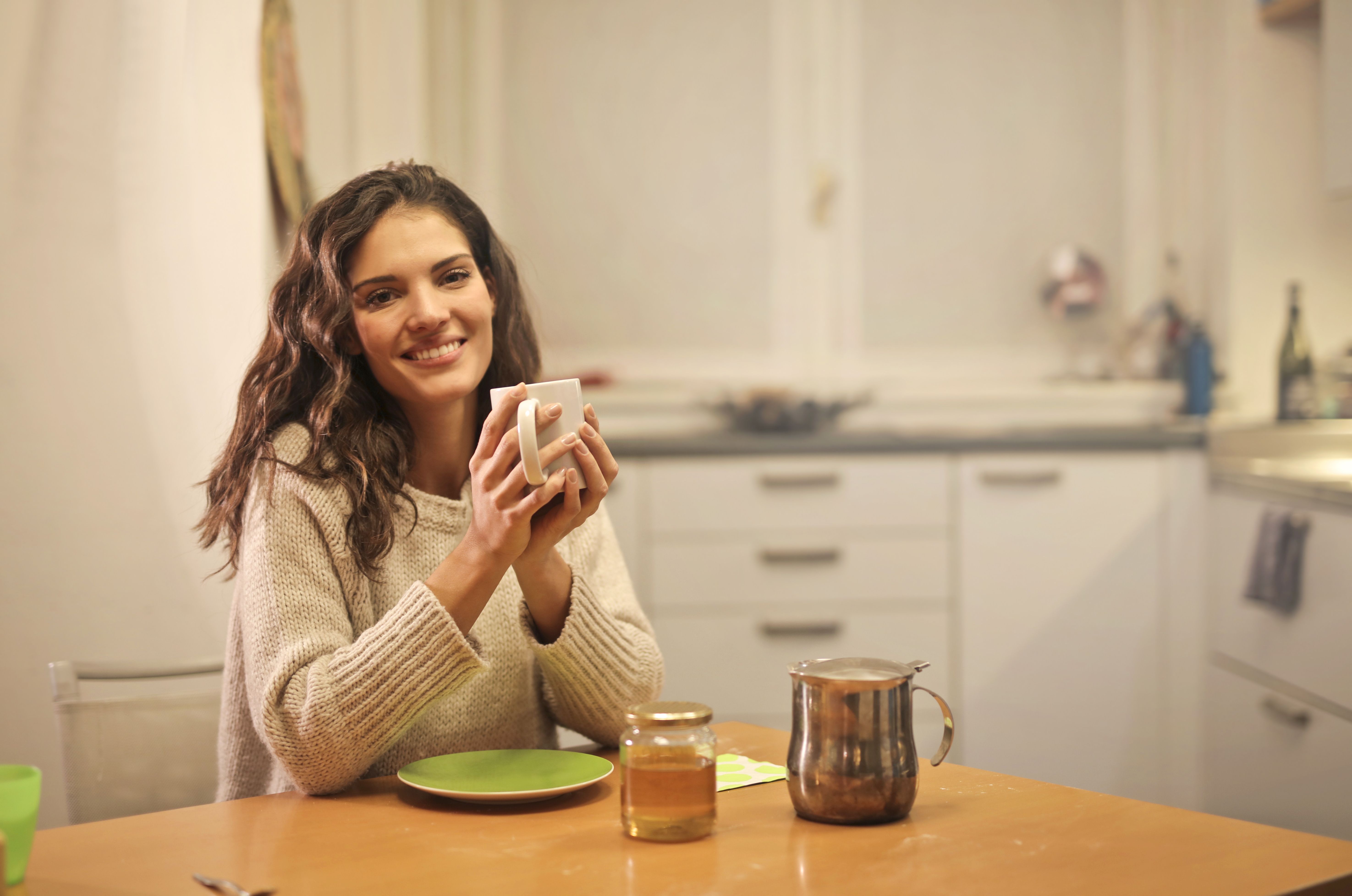 Portrait of Woman Drinking Coffee in Kitchen · Free Stock Photo