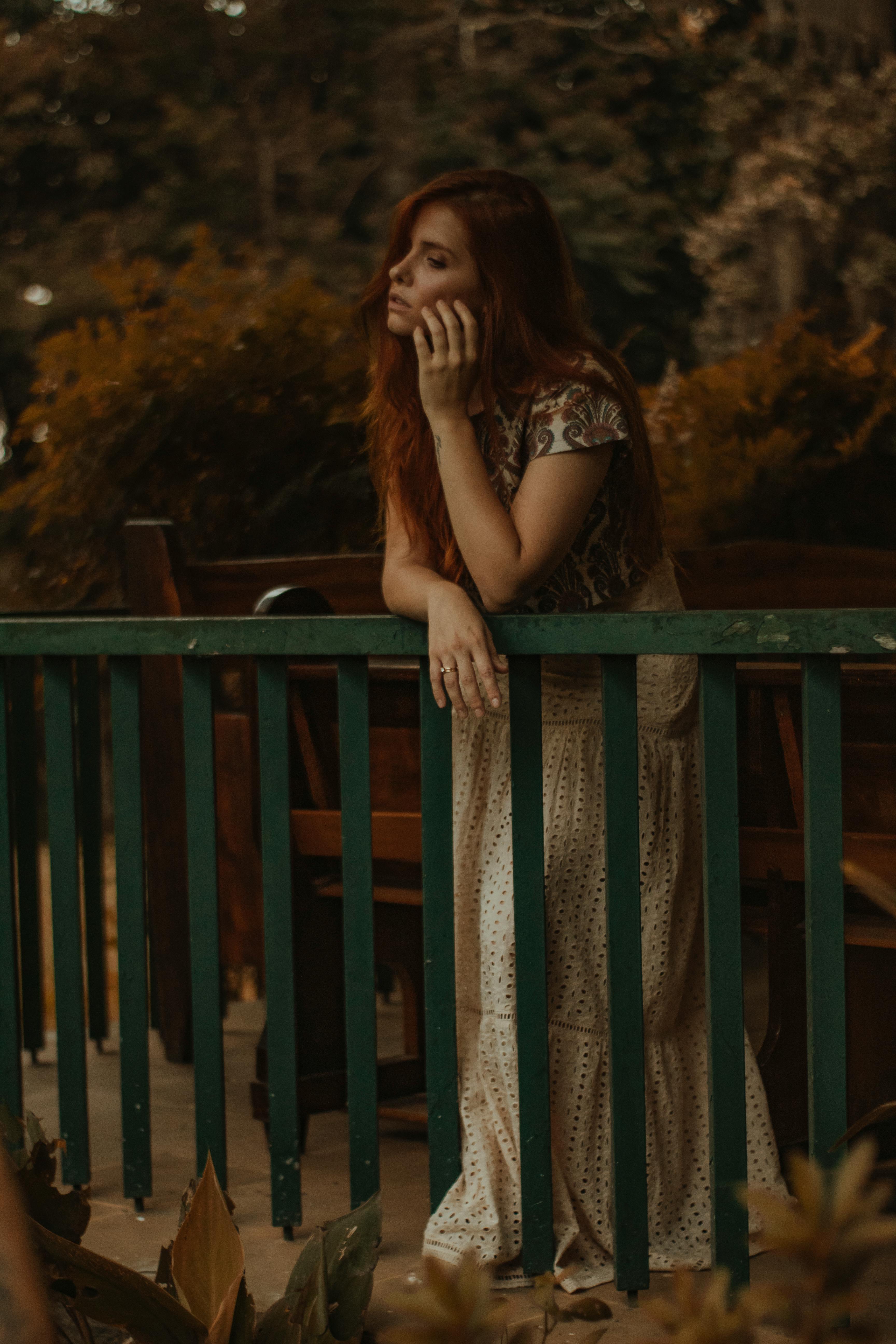 Woman Sitting on Railing · Free Stock Photo