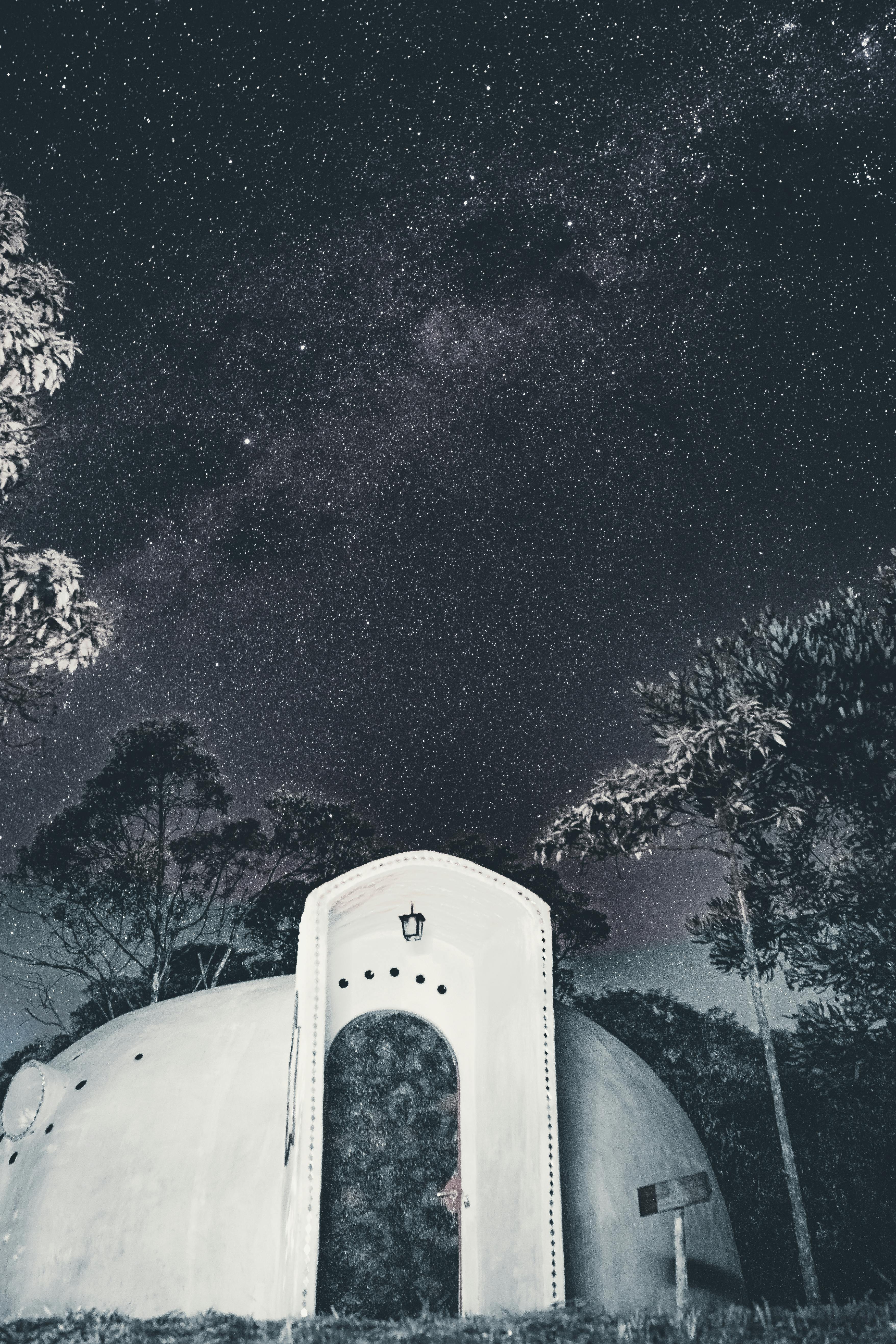 White Concrete Building Under Starry Night · Free Stock Photo