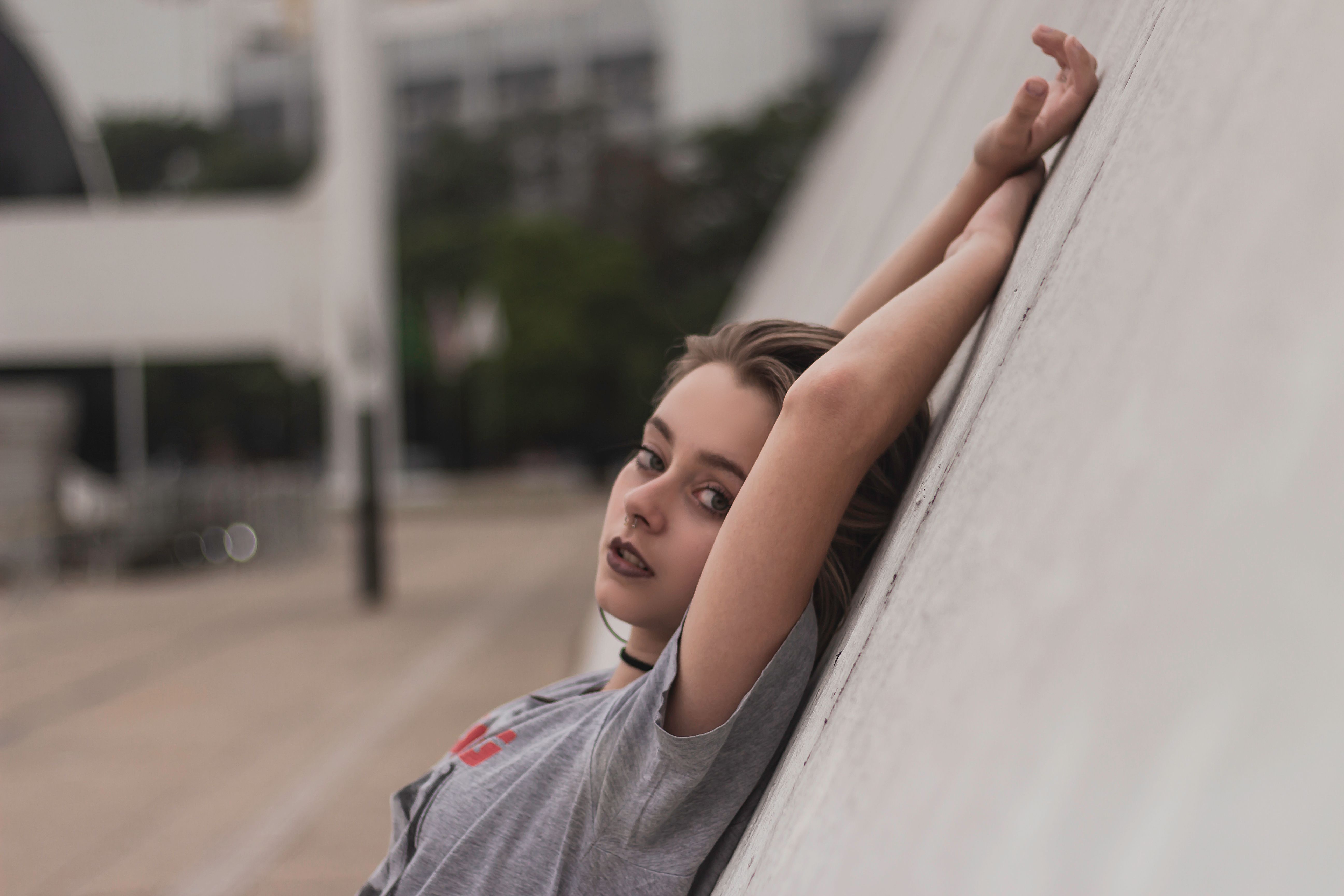 Woman Standing Beside Building · Free Stock Photo