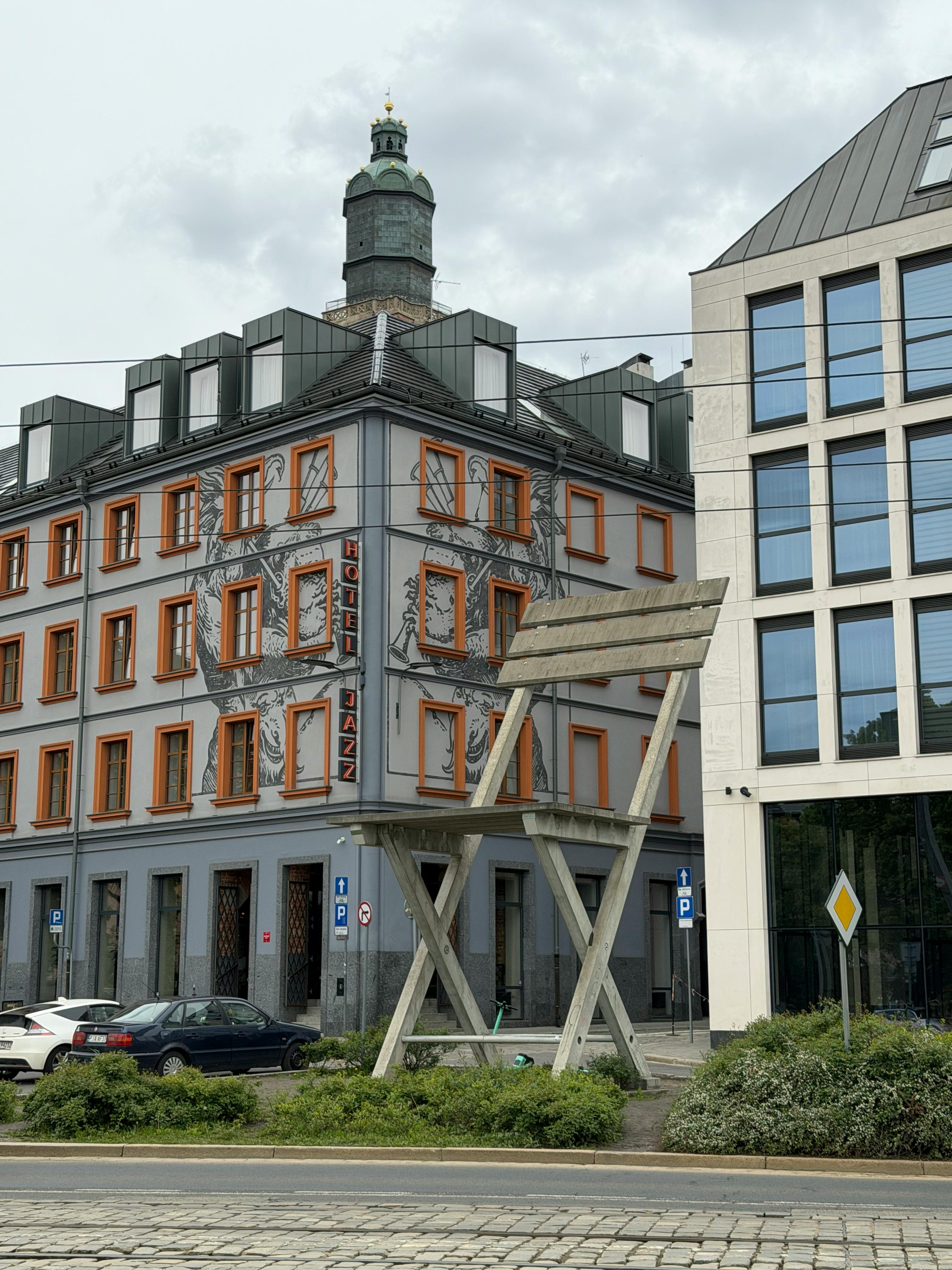 Artistic Hotel Facade with Large Chair Sculpture · Free Stock Photo