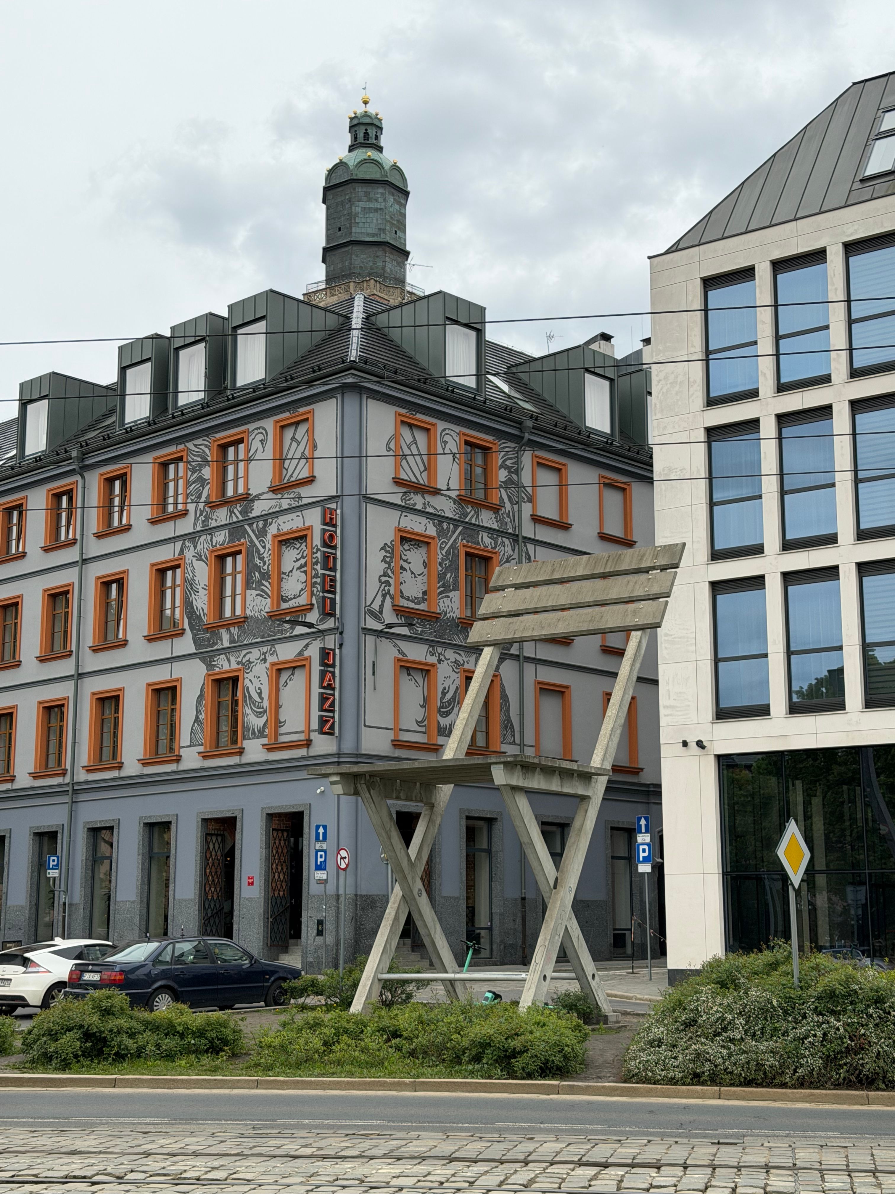 Artistic Hotel Facade with Large Chair Sculpture · Free Stock Photo