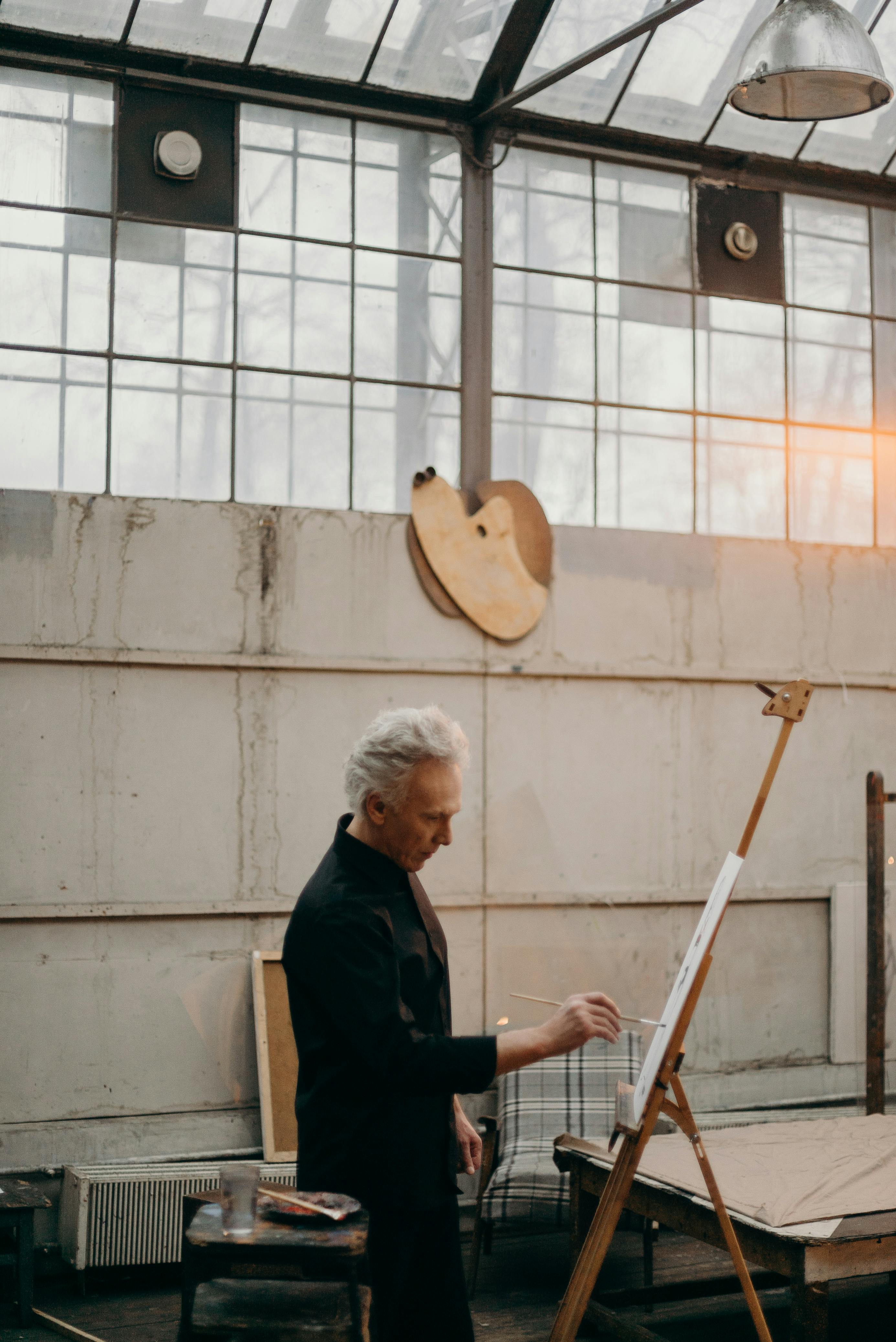 Crop artist with paintbrush in studio · Free Stock Photo