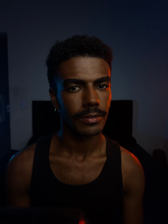 Moody Portrait of a Man with Dramatic Lighting · Free Stock Photo