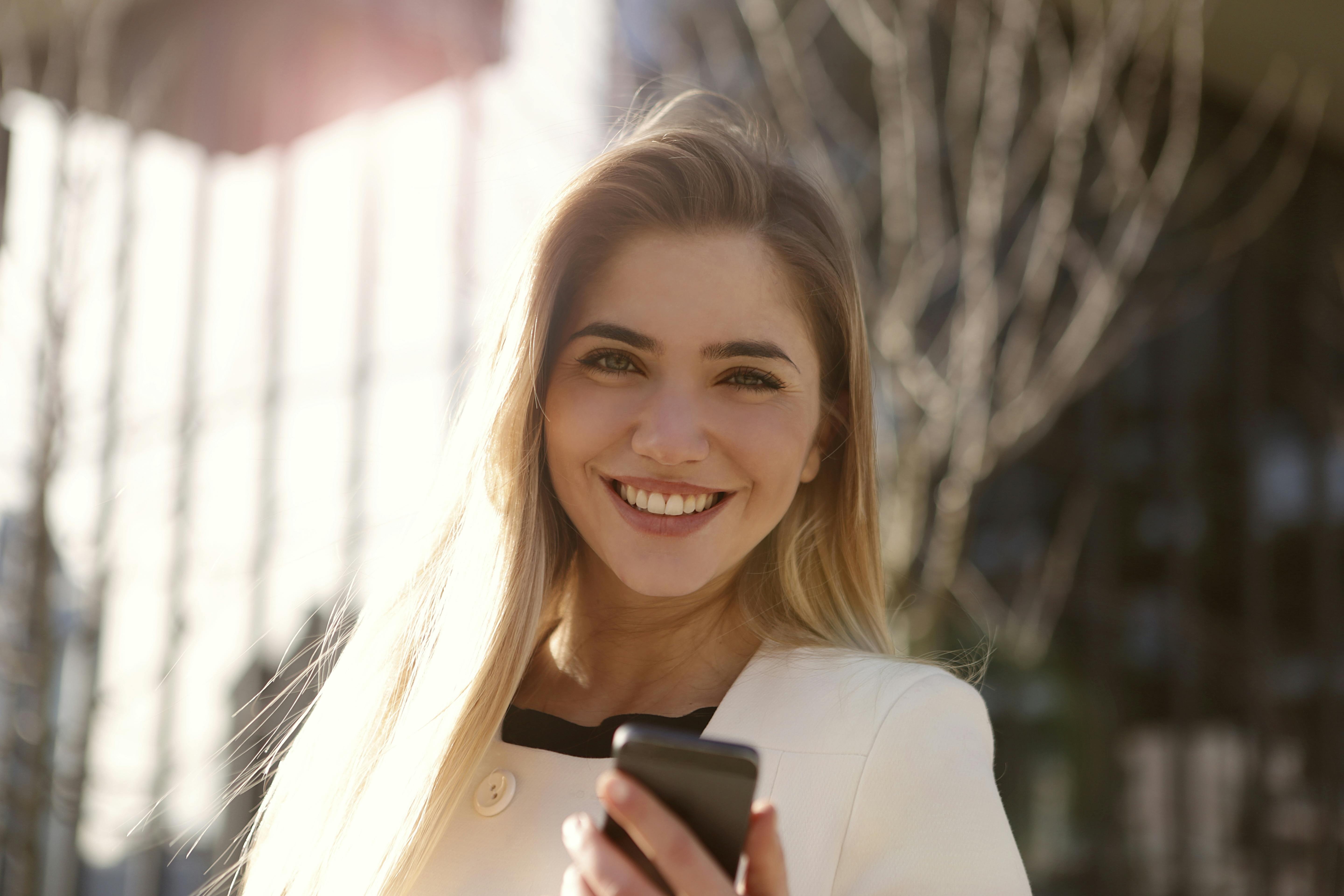 Woman Using Her Smartphone · Free Stock Photo