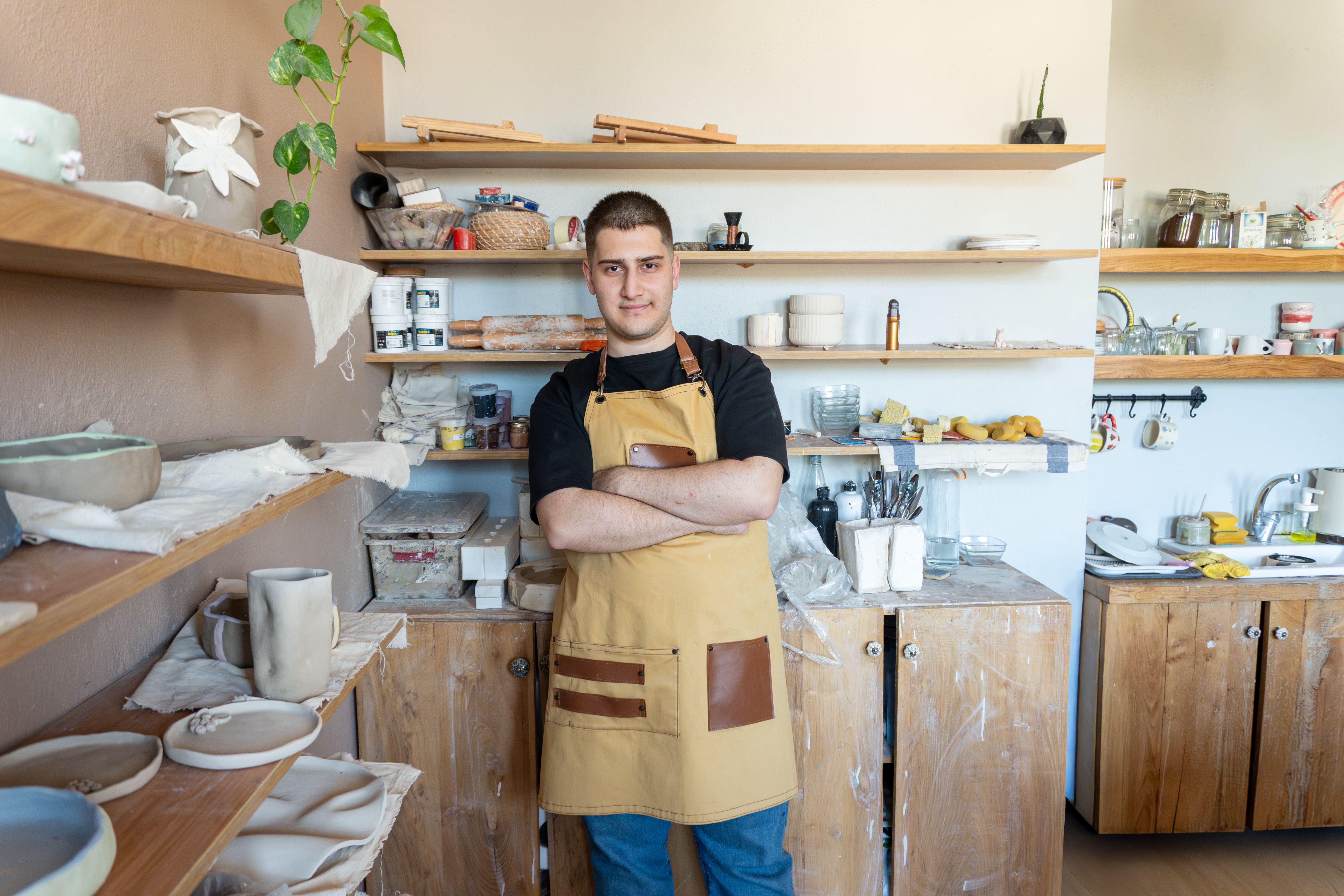 Young Potter Crafting Ceramics in Studio · Free Stock Photo