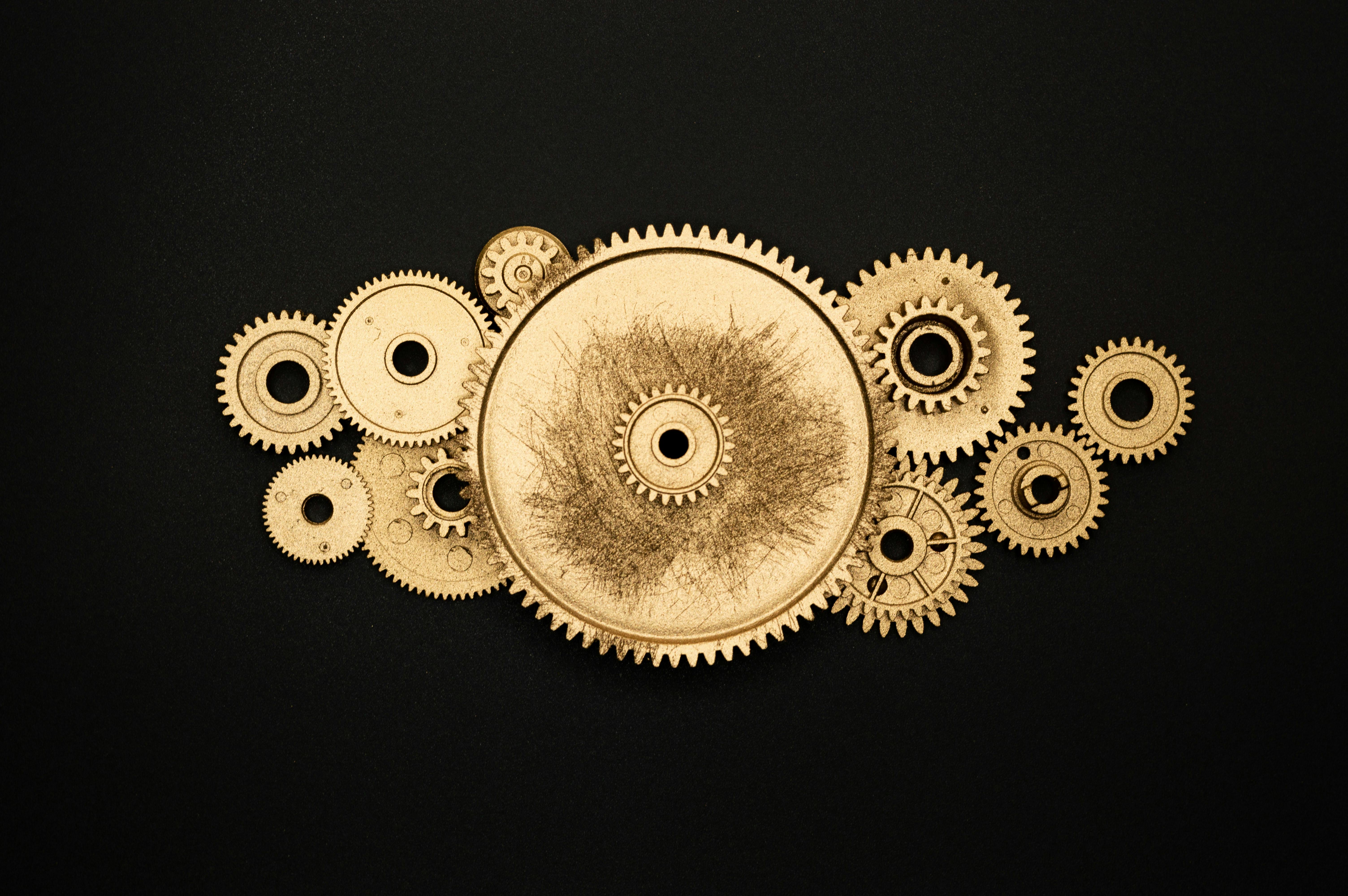 Photo of Golden Cogwheel on Black Background · Free Stock Photo
