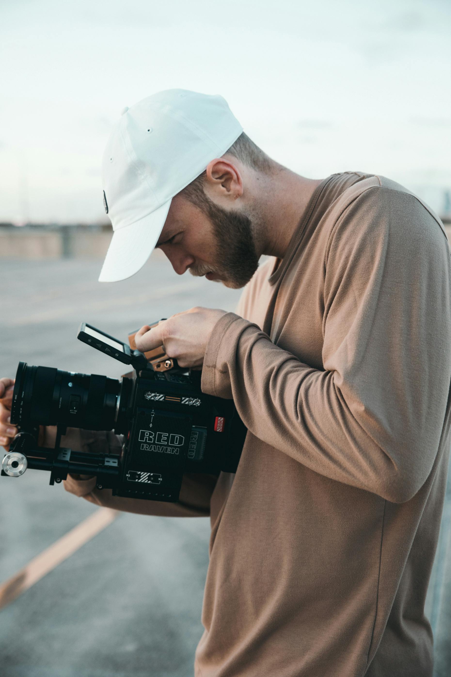 A Filmmaker Shooting a Footage · Free Stock Photo