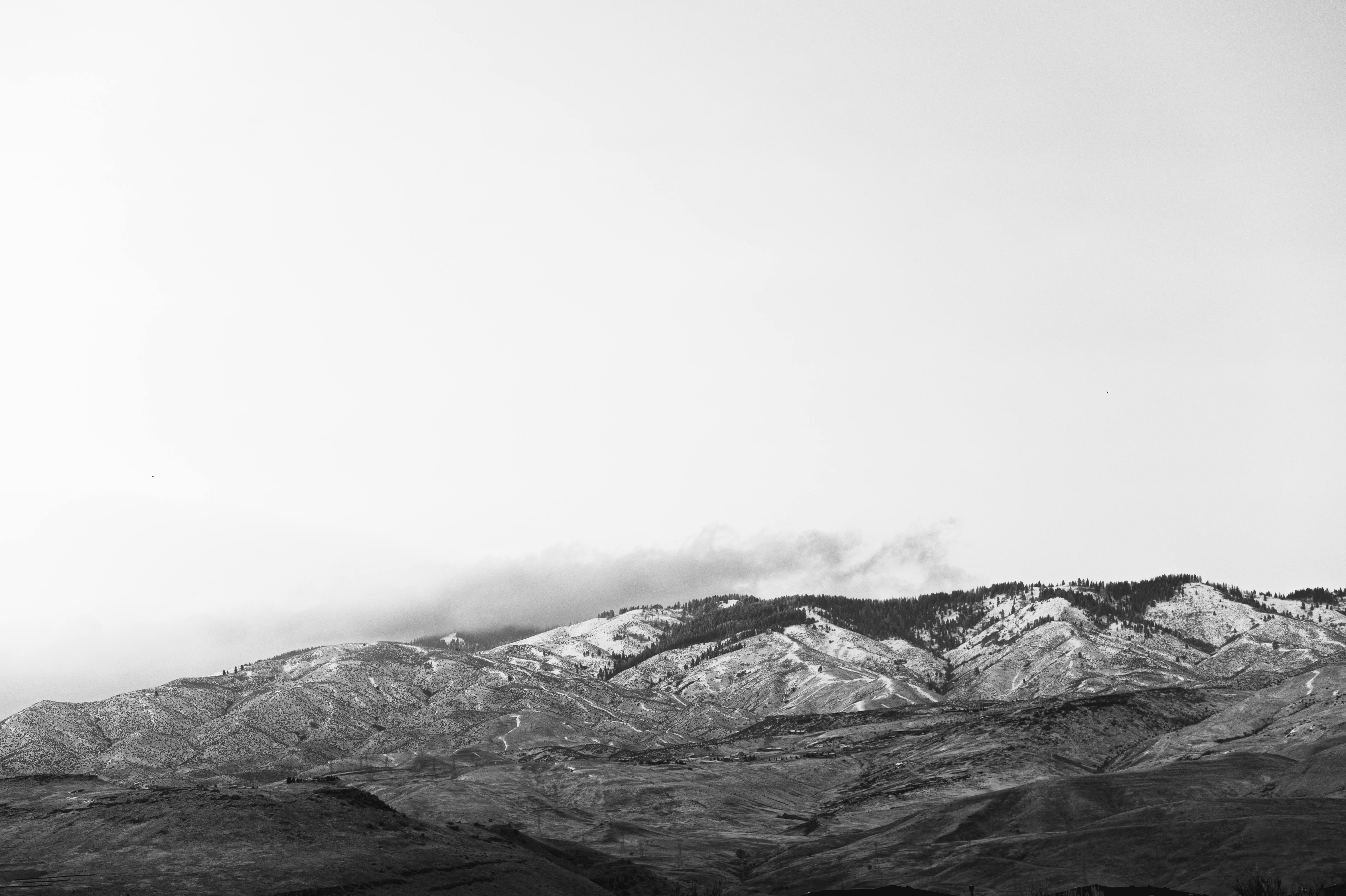 Grayscale Photo of Mountain Range · Free Stock Photo