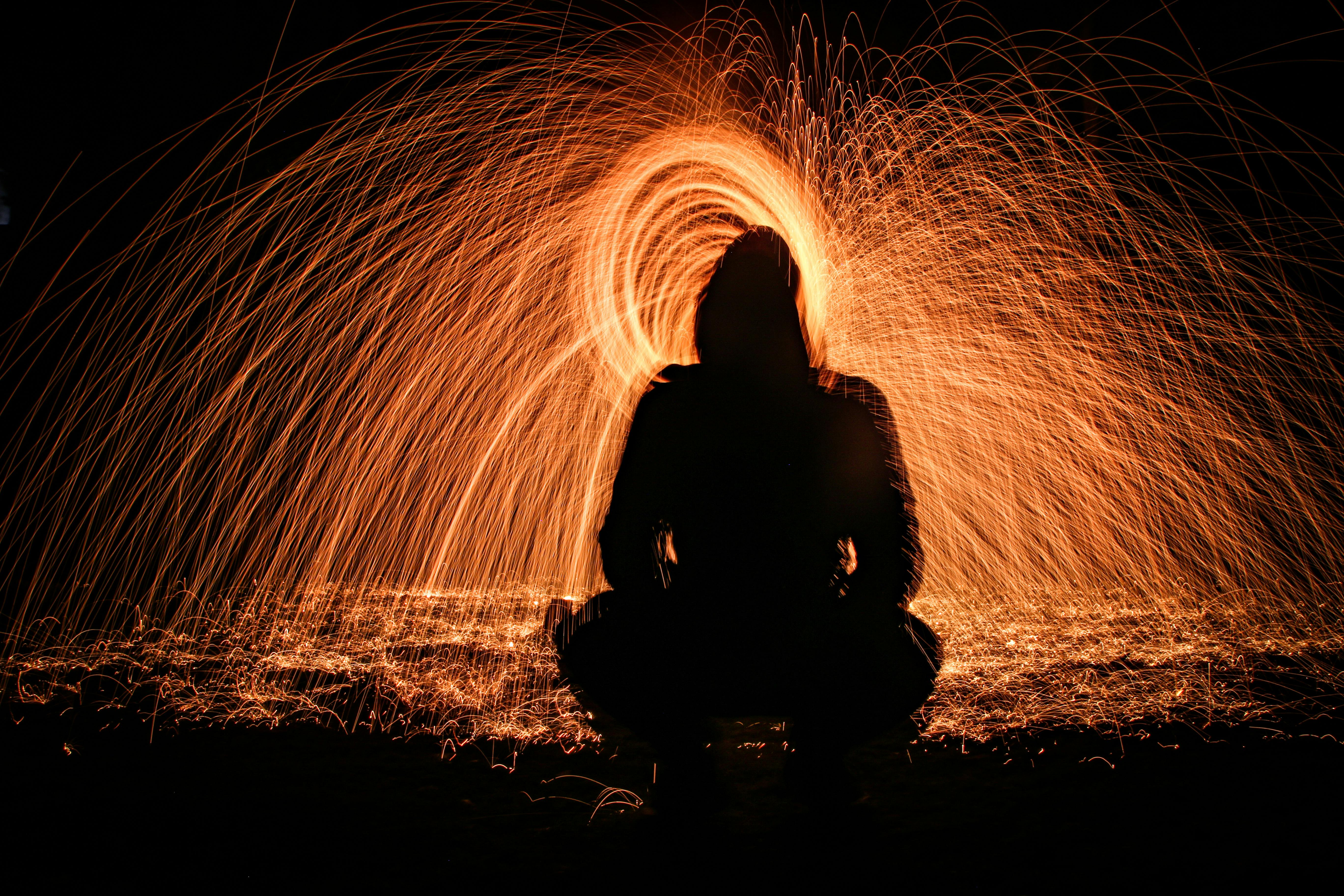 A Person Sitting near Red Light · Free Stock Photo