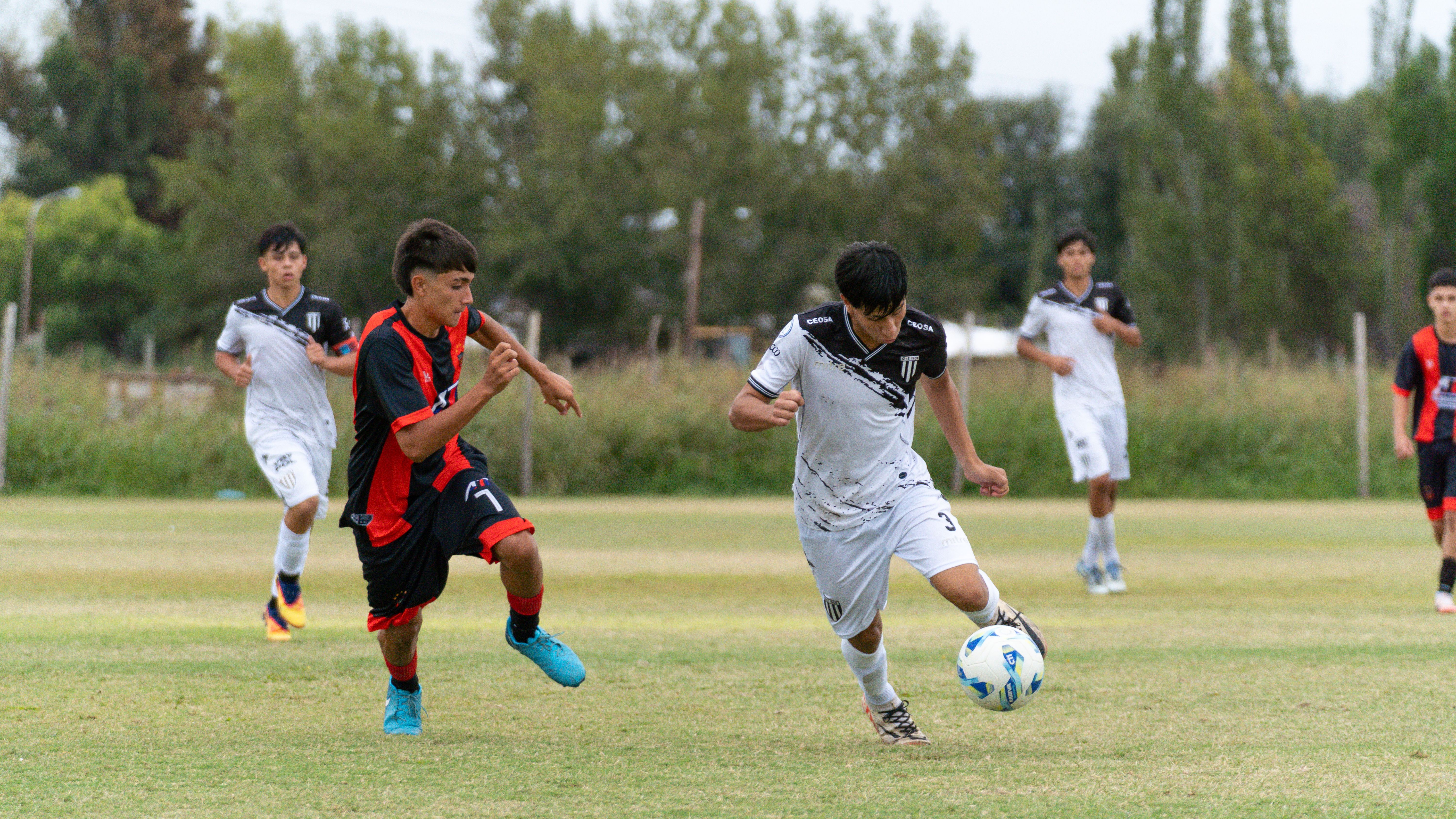 Young Athletes Competing in Intense Soccer Match · Free Stock Photo