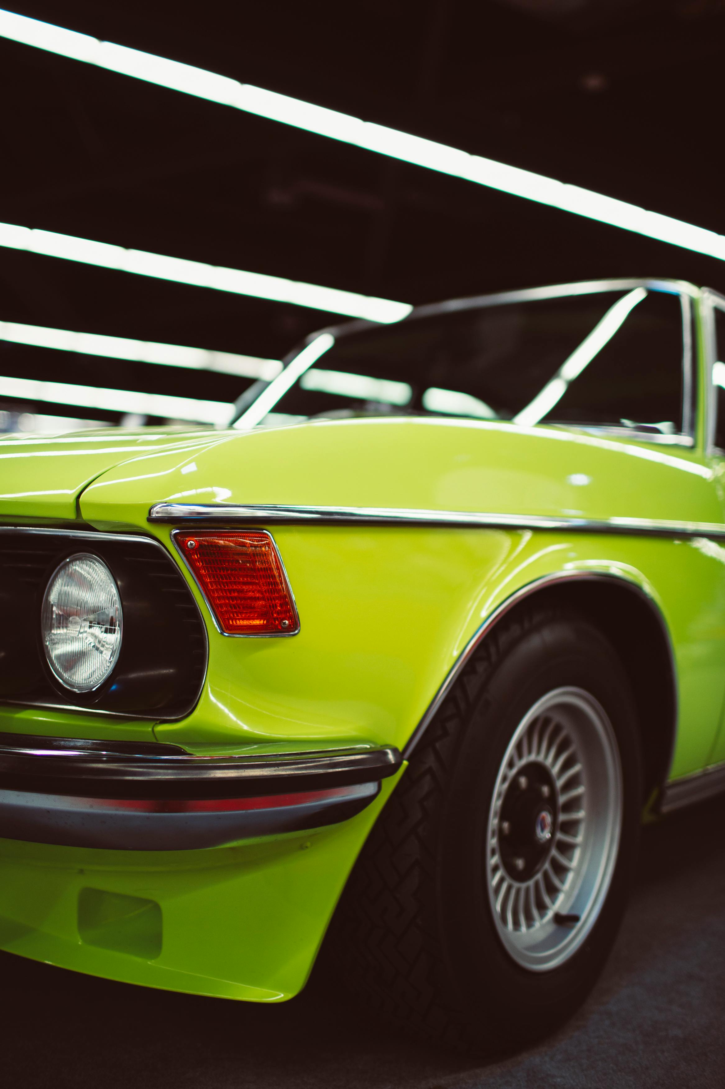 Retro car in bright neon color · Free Stock Photo