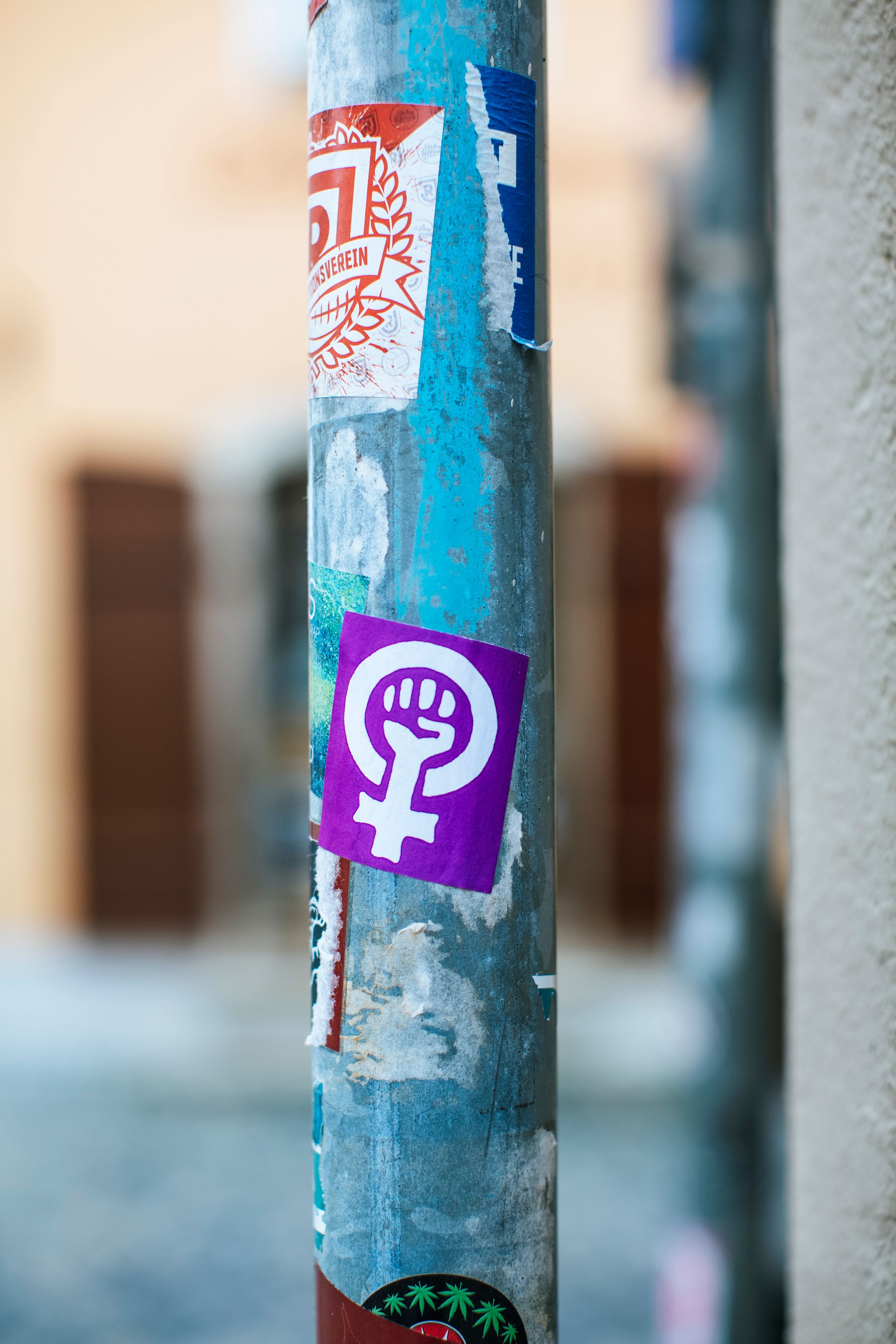 Street pole with colorful stickers · Free Stock Photo