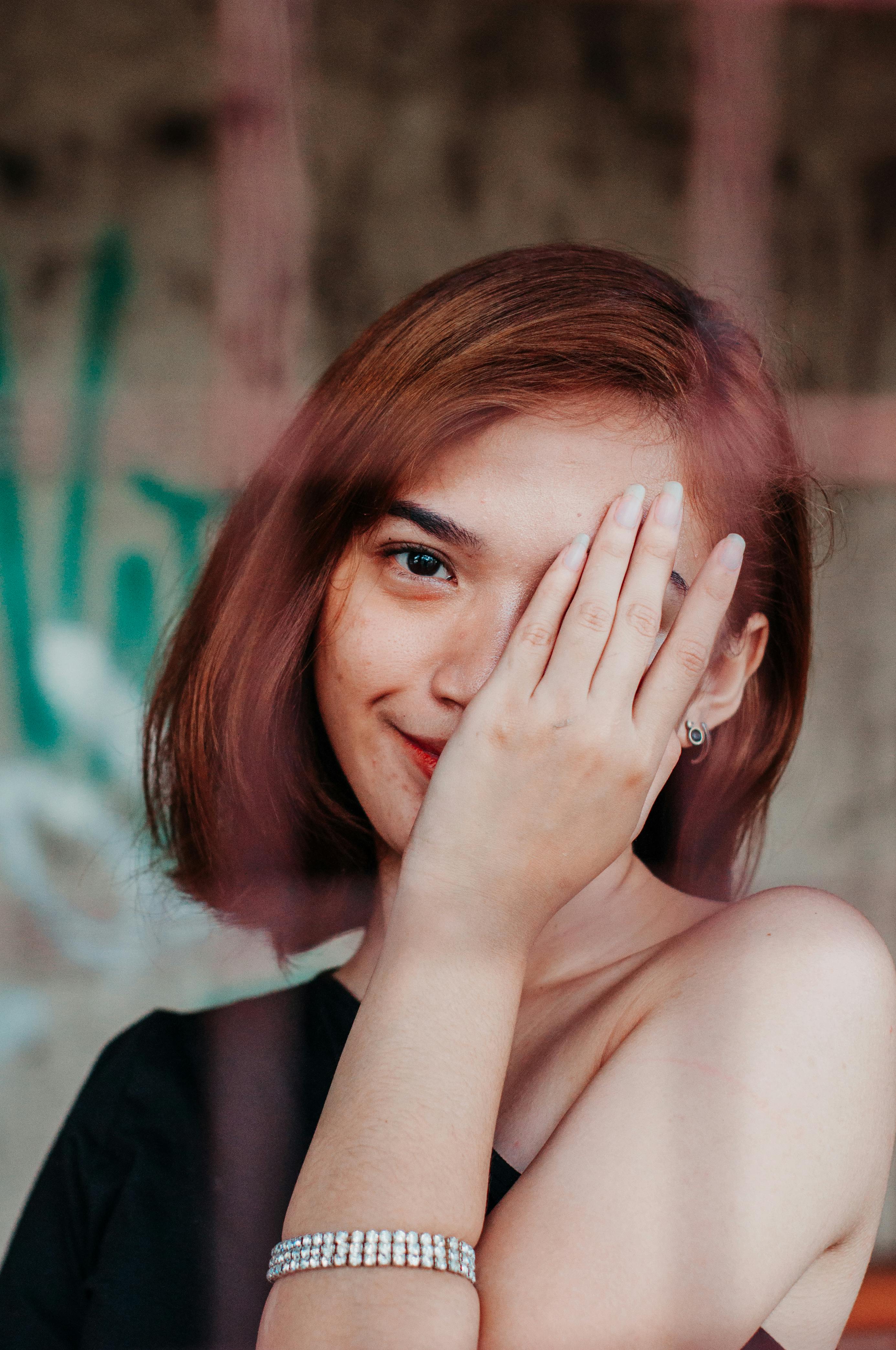 Shallow Focus Photo of Woman Smirking · Free Stock Photo