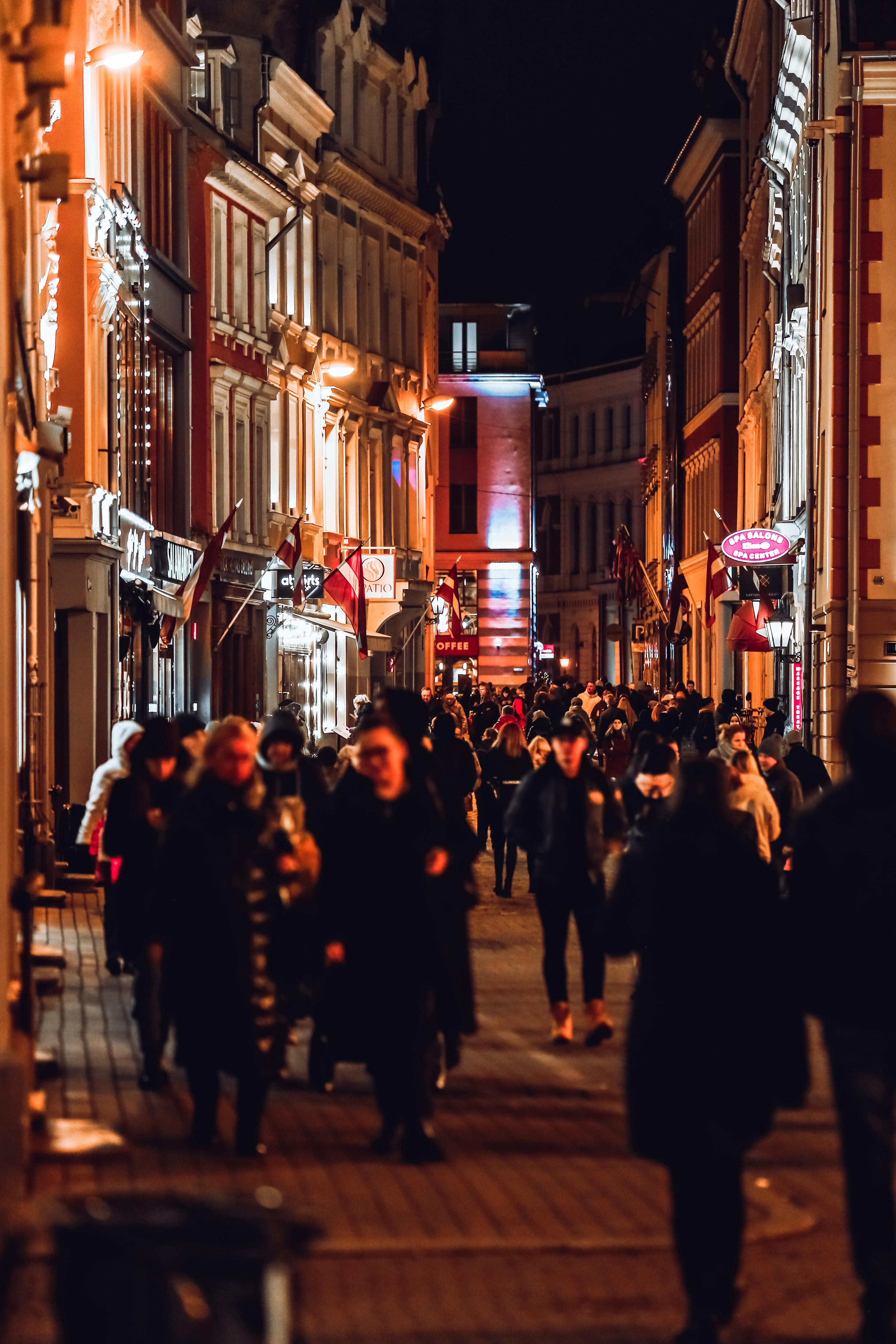 Anonymous people chilling in street in town district at night · Free ...