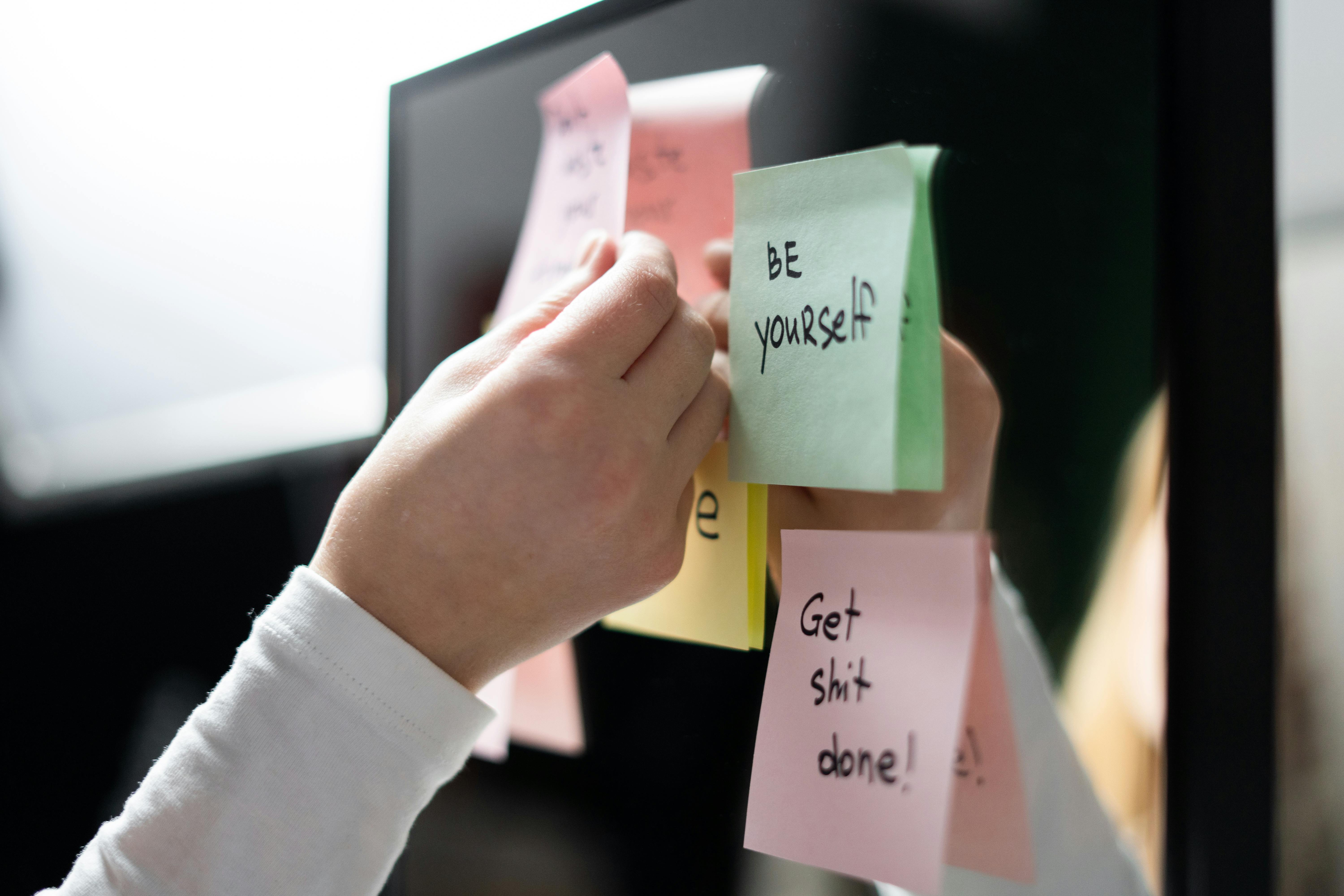 Person Holding White and Pink Sticky Notes · Free Stock Photo