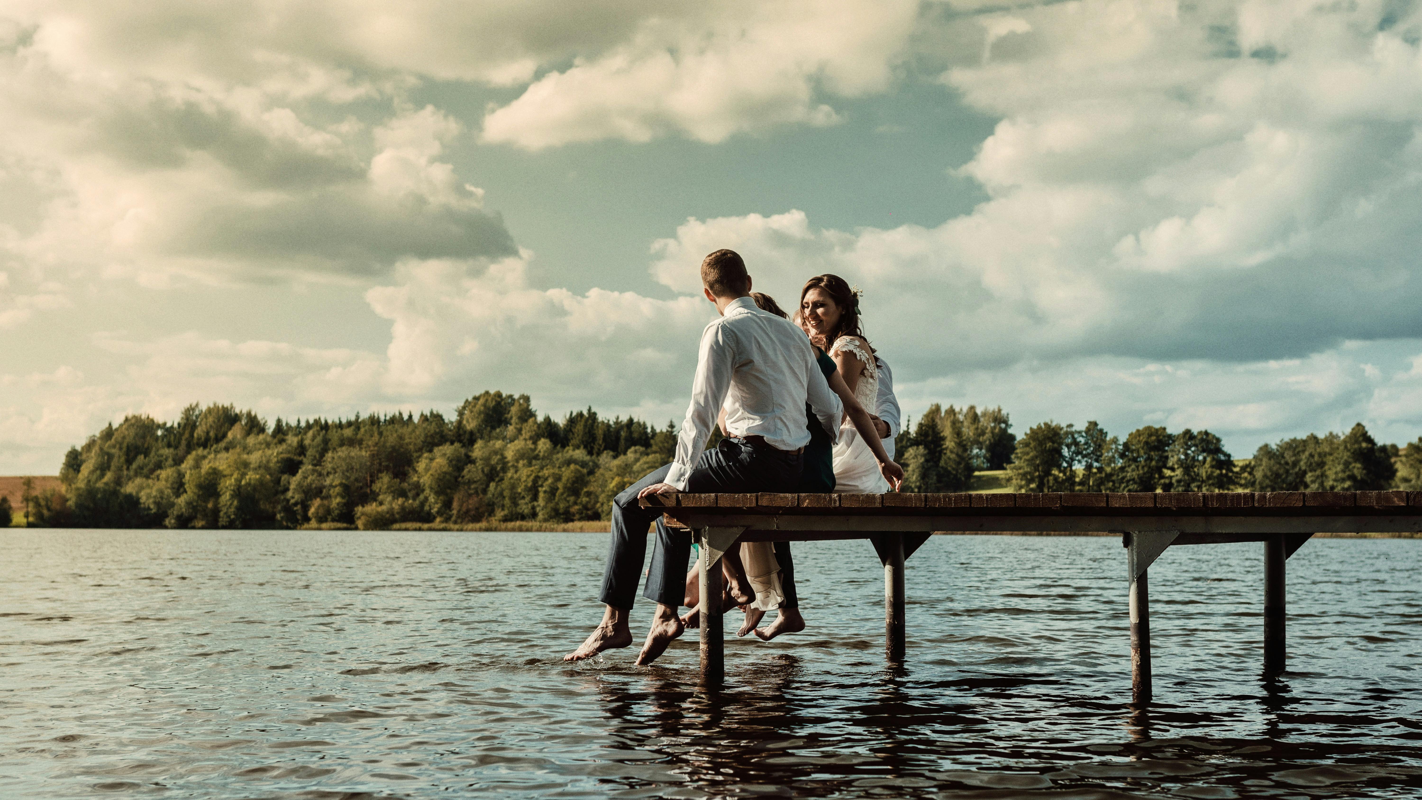 People Sitting On Wooden Dock · Free Stock Photo