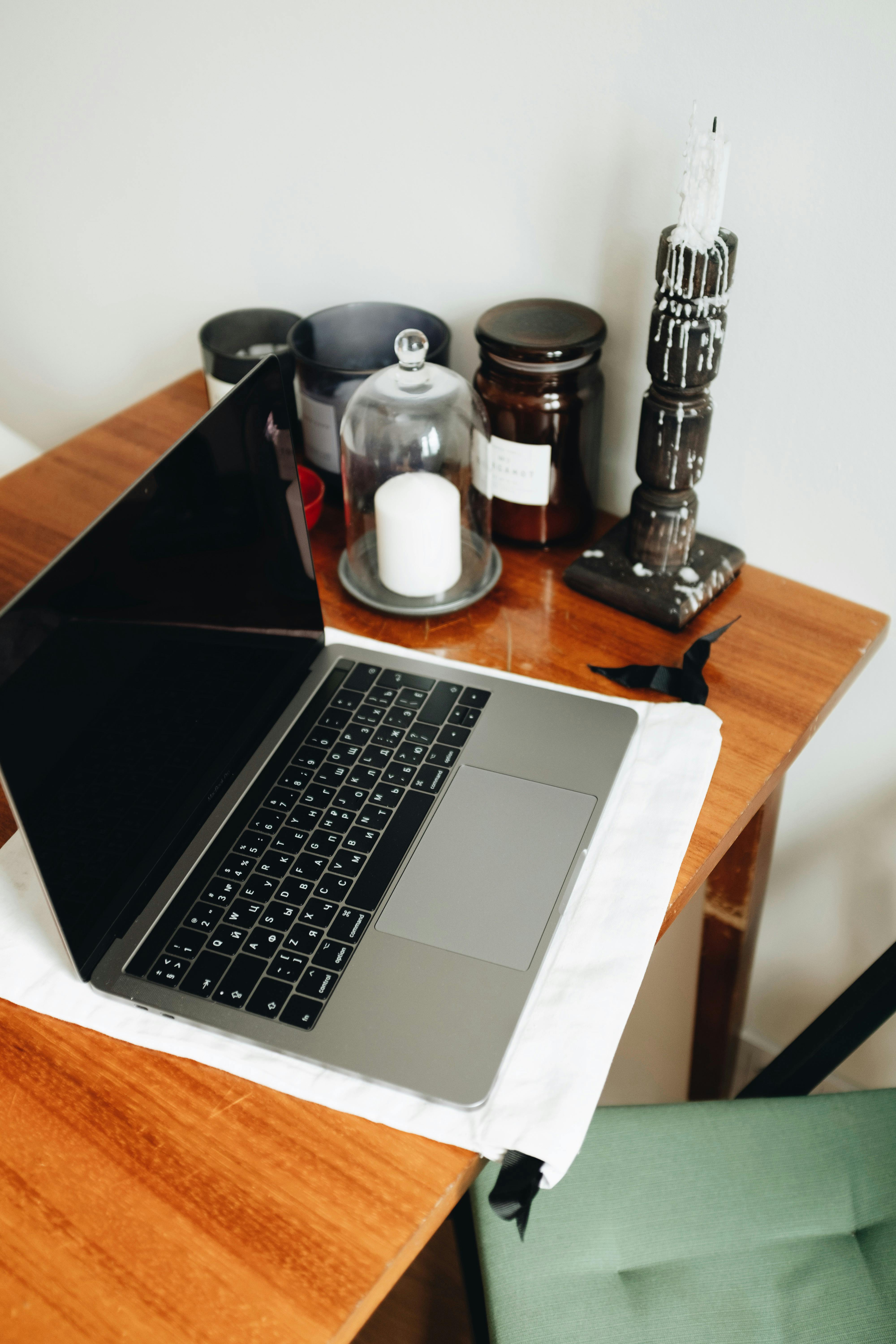 Macbook Pro on Brown Wooden Table · Free Stock Photo