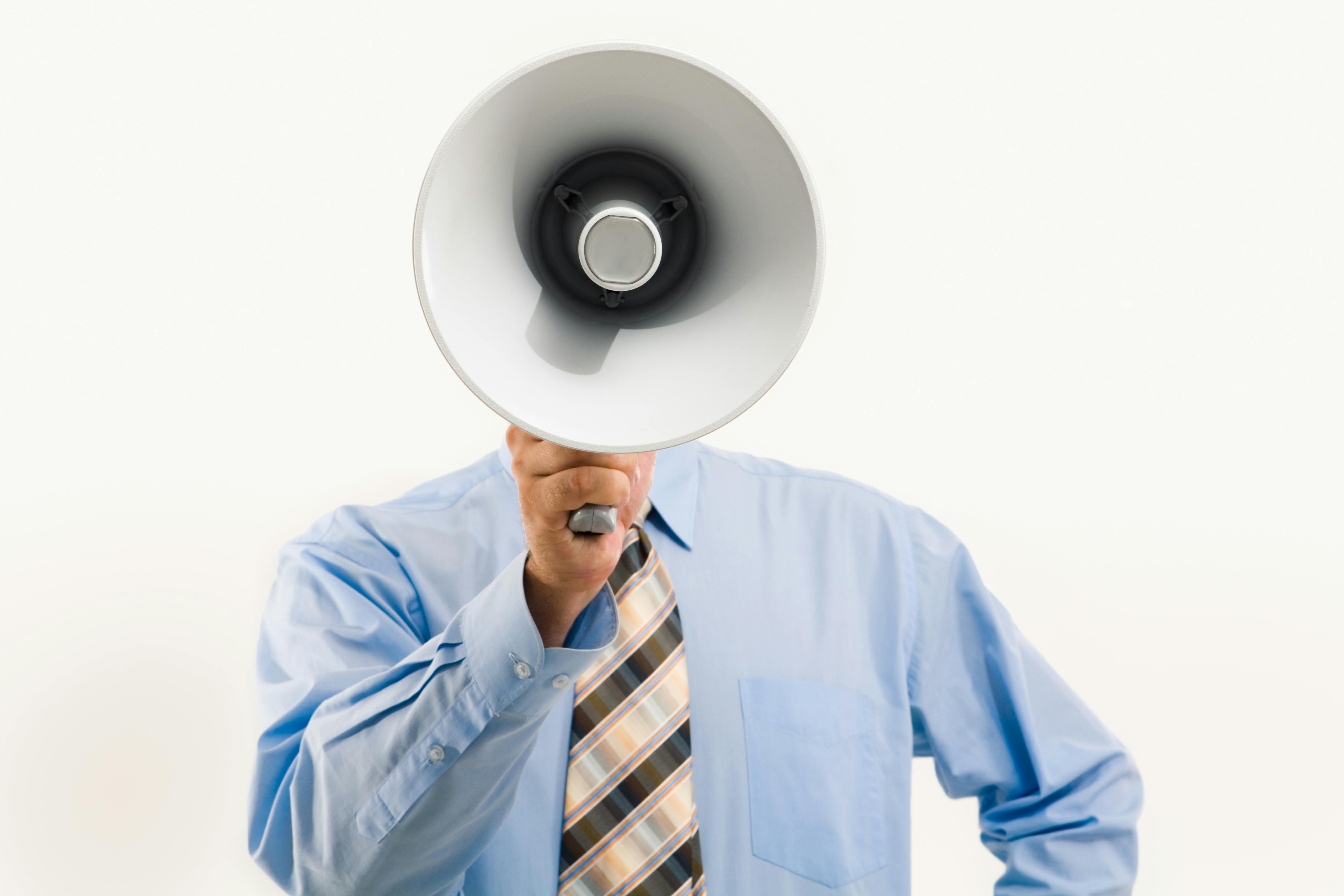 Man Holding a Megaphone · Free Stock Photo