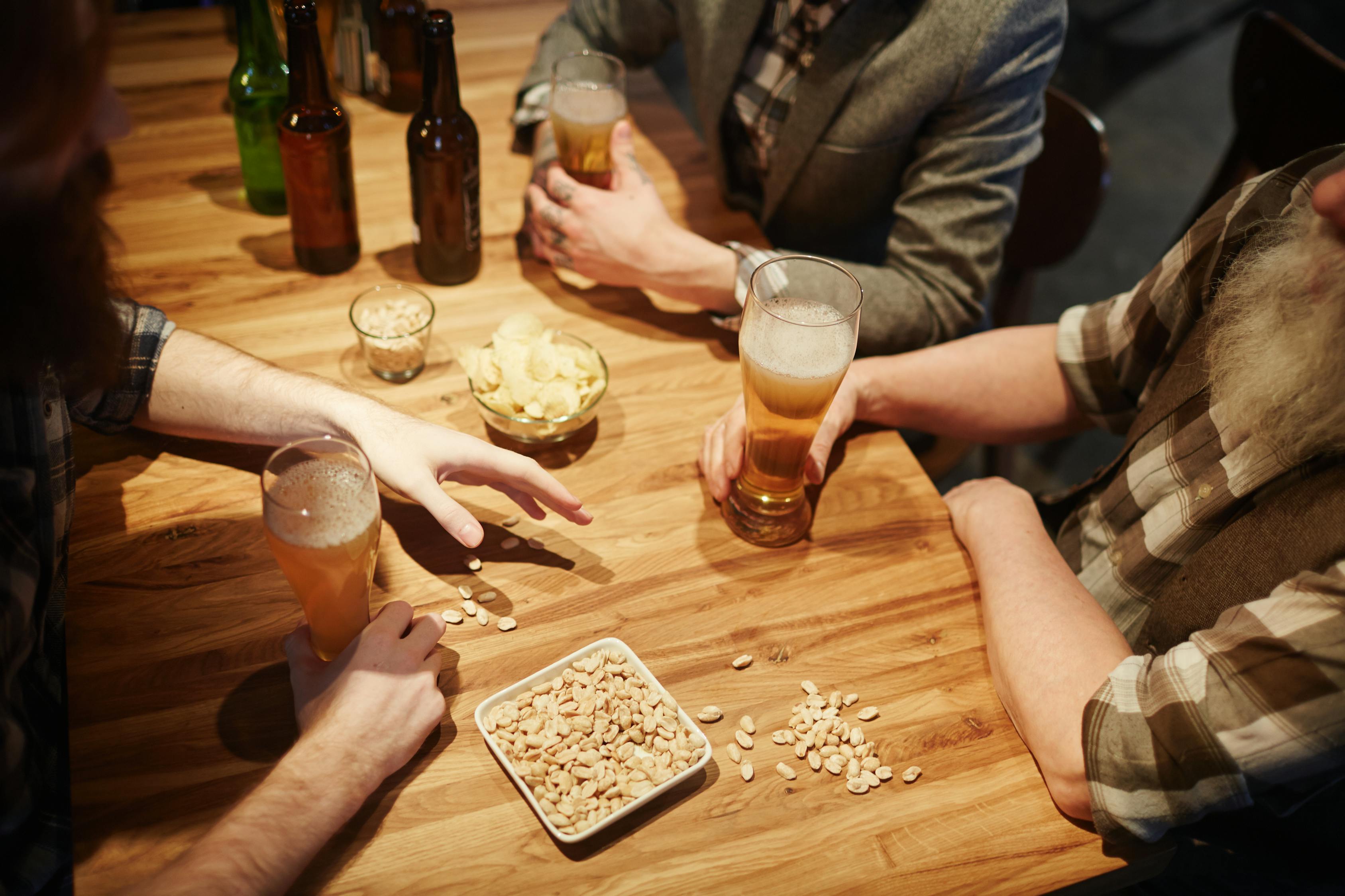 Men With Beer At A Bar Free Stock Photo men-with-beer-at-a-bar-free-stock-photo