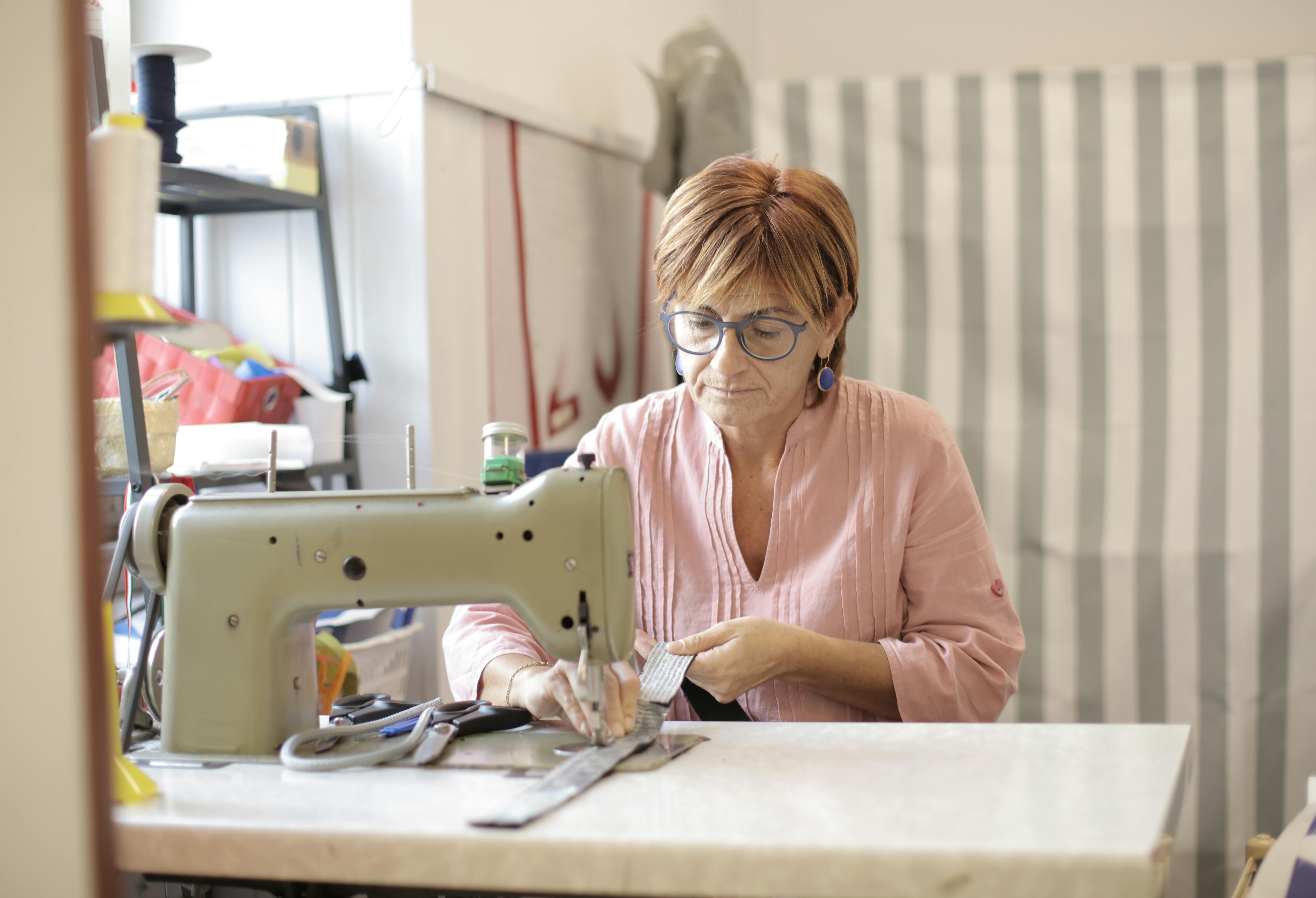 Woman Using Sewing Machine · Free Stock Photo