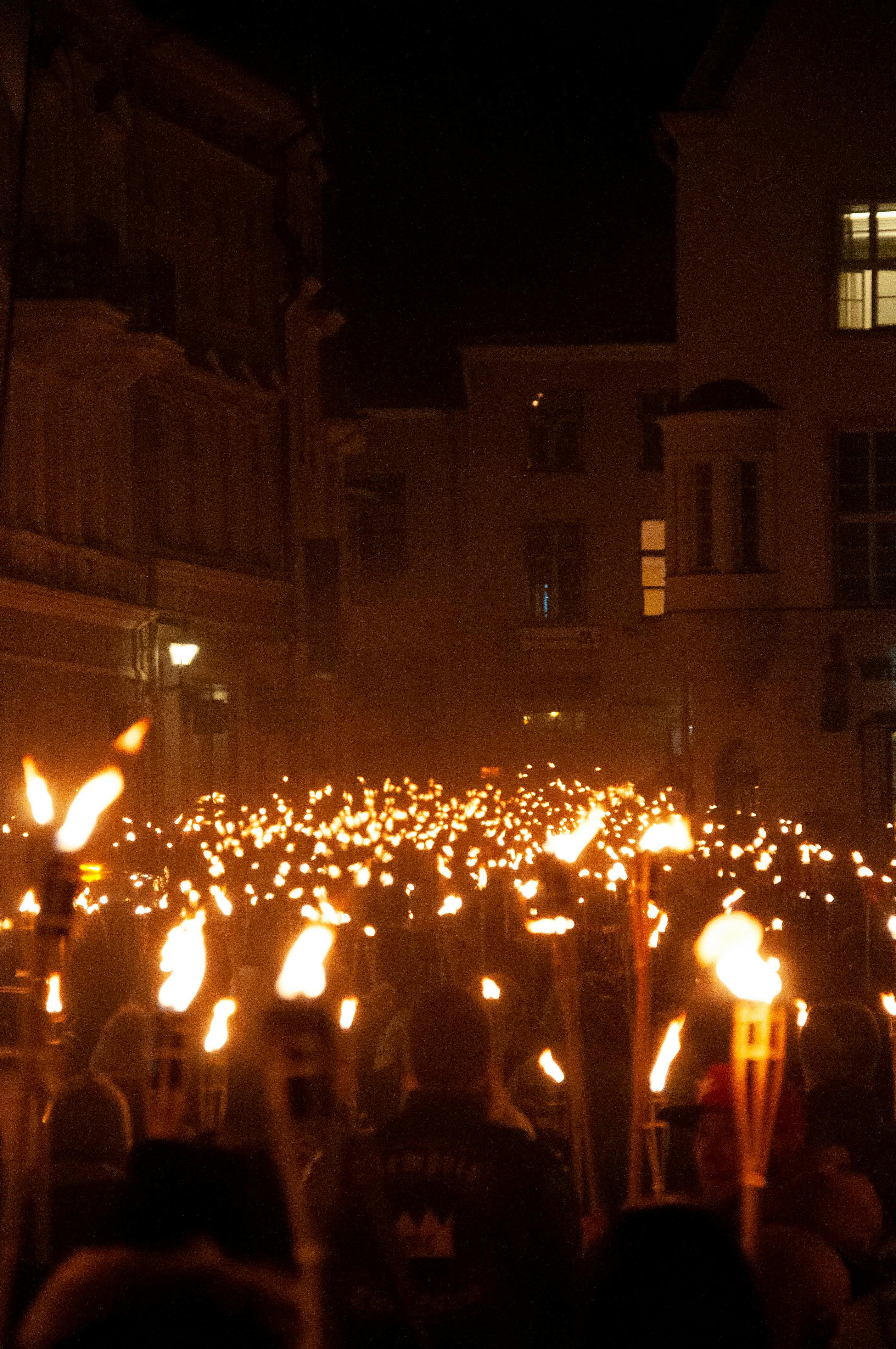 Torchlight procession in city at night · Free Stock Photo