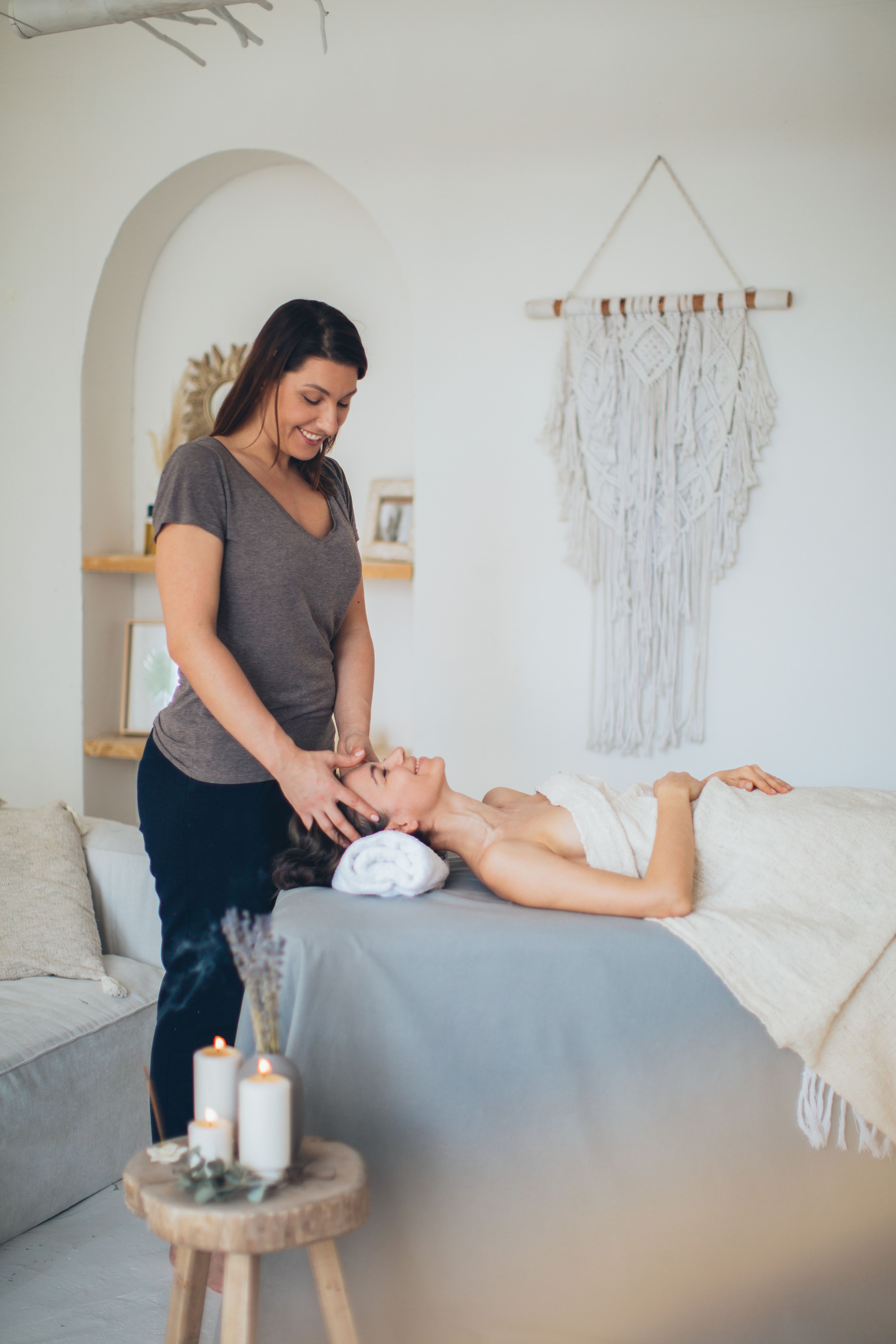 A Topless Woman Having a Back Massage · Free Stock Photo